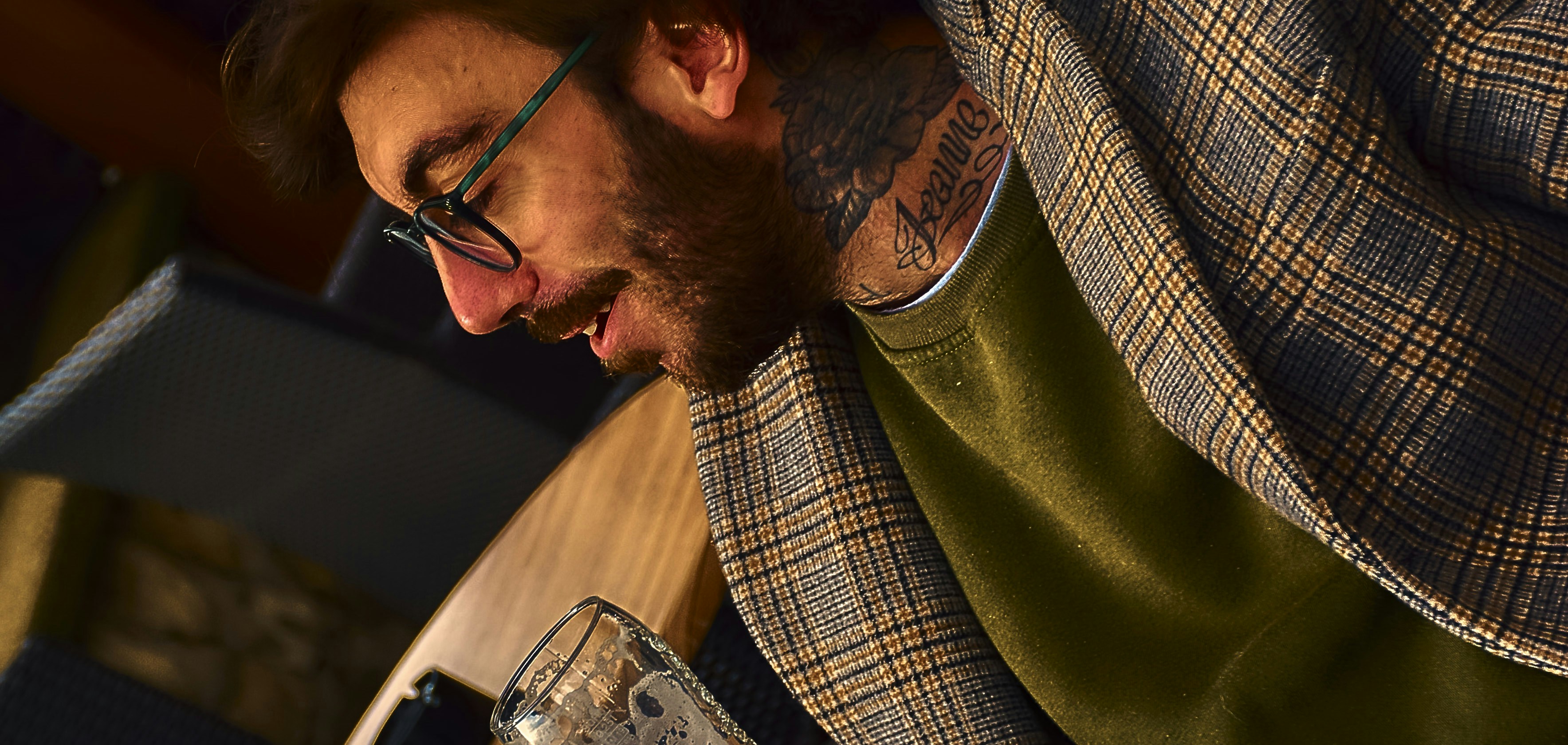 Bearded Contemplation at the Bar: Warm Wood, Focused Gaze