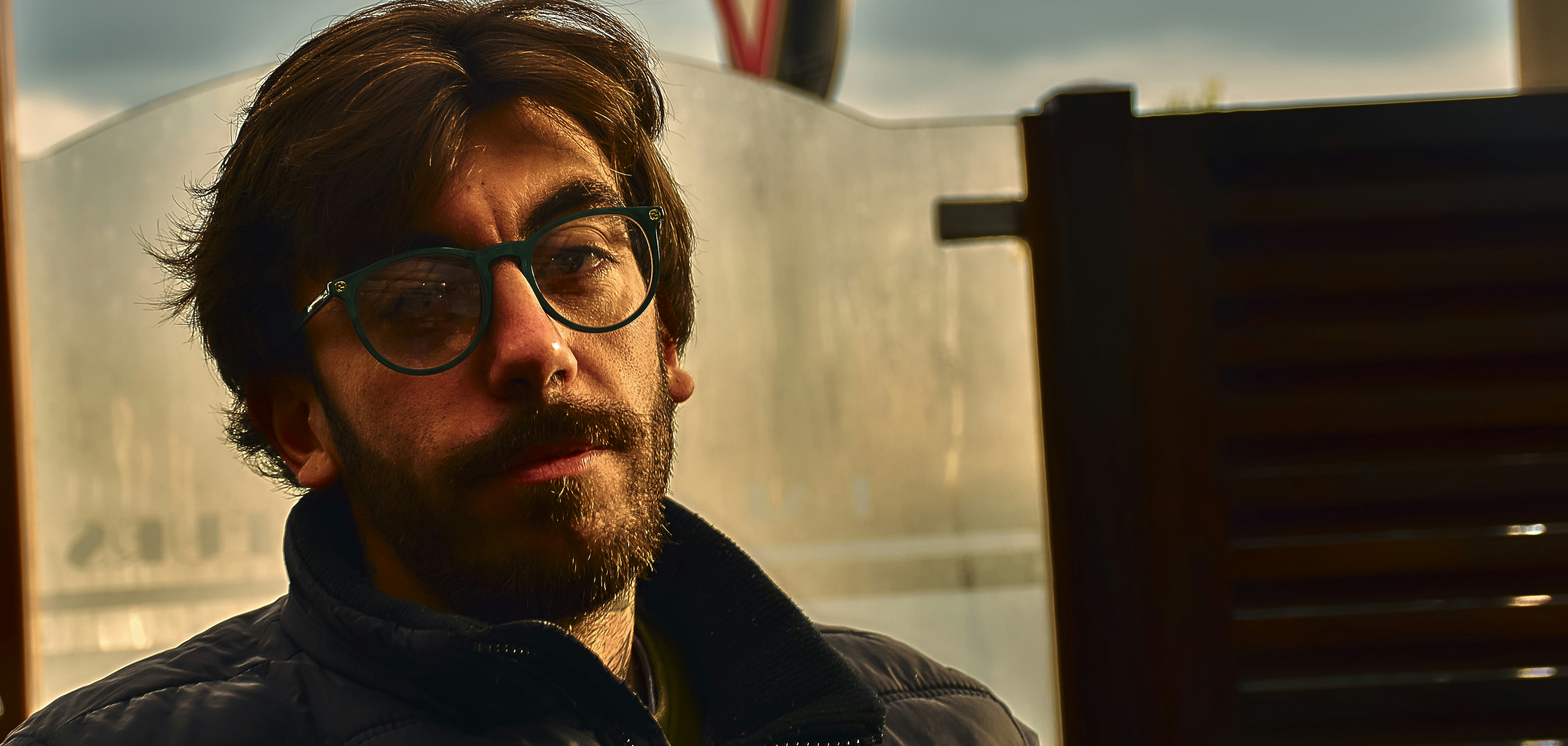 Amber Gaze Through Glass: A Quiet Portrait in Transit