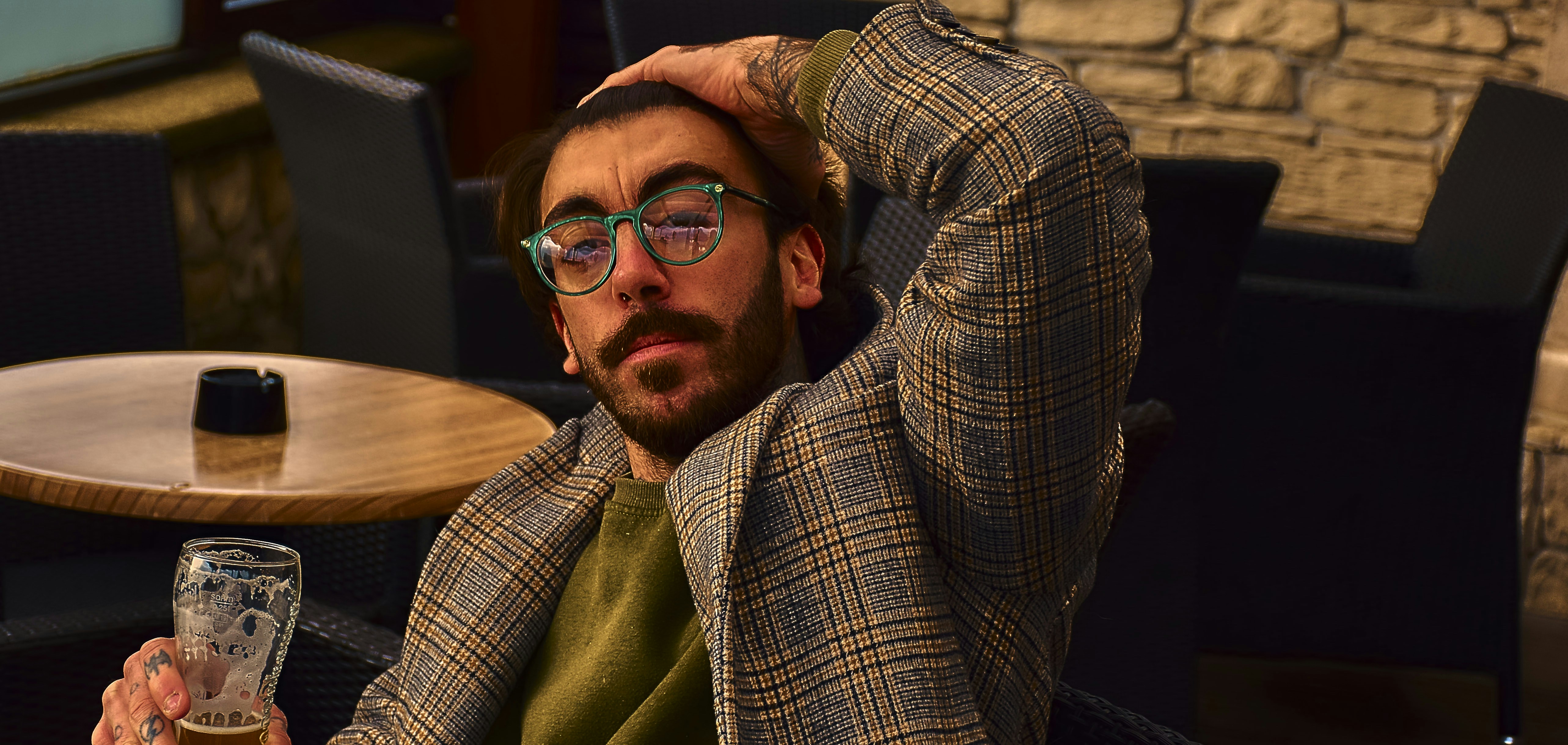 Lounge Light: A Plaid-Suited Moment of Contemplation
