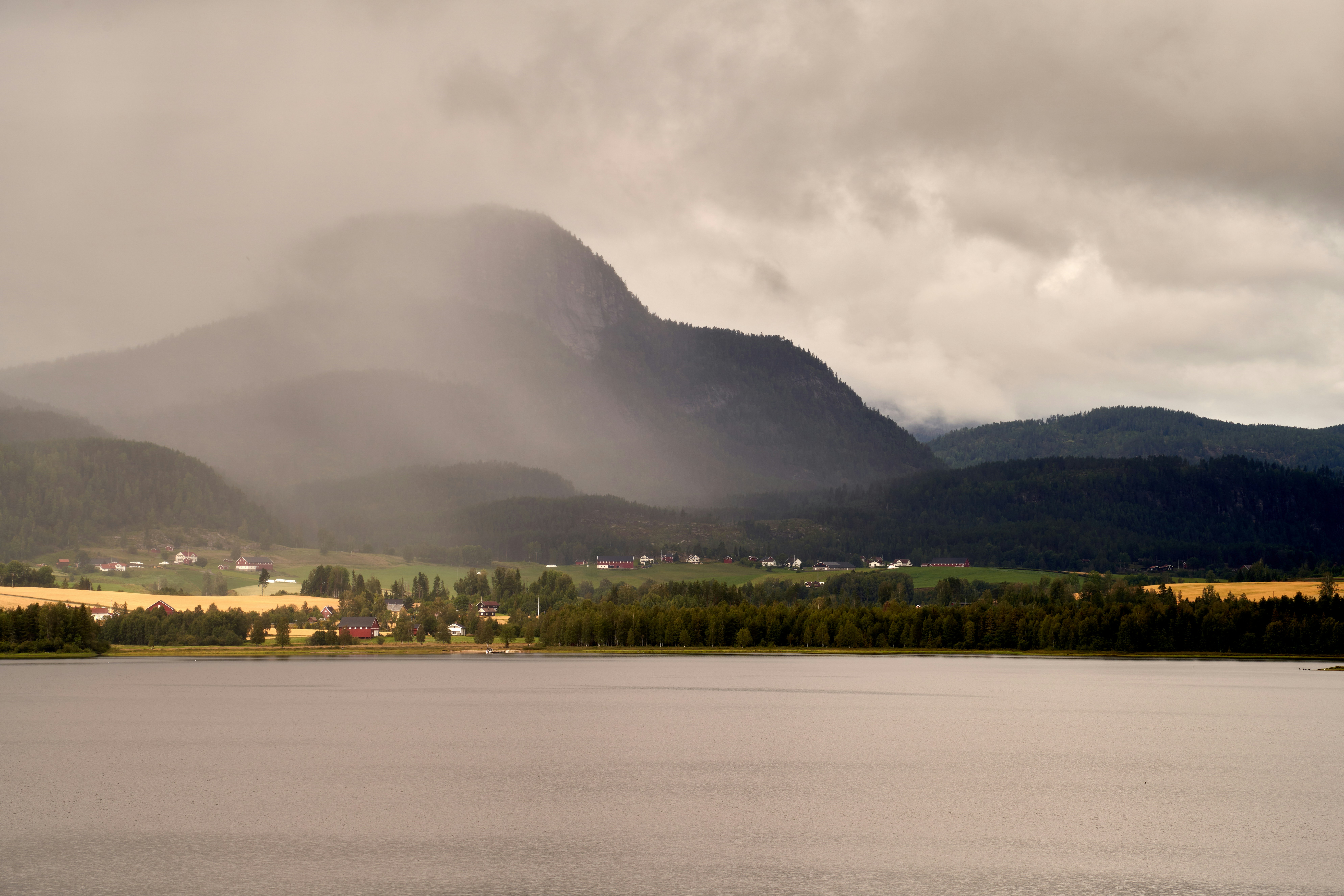 Mist-veiled Peak over a Quiet Lake