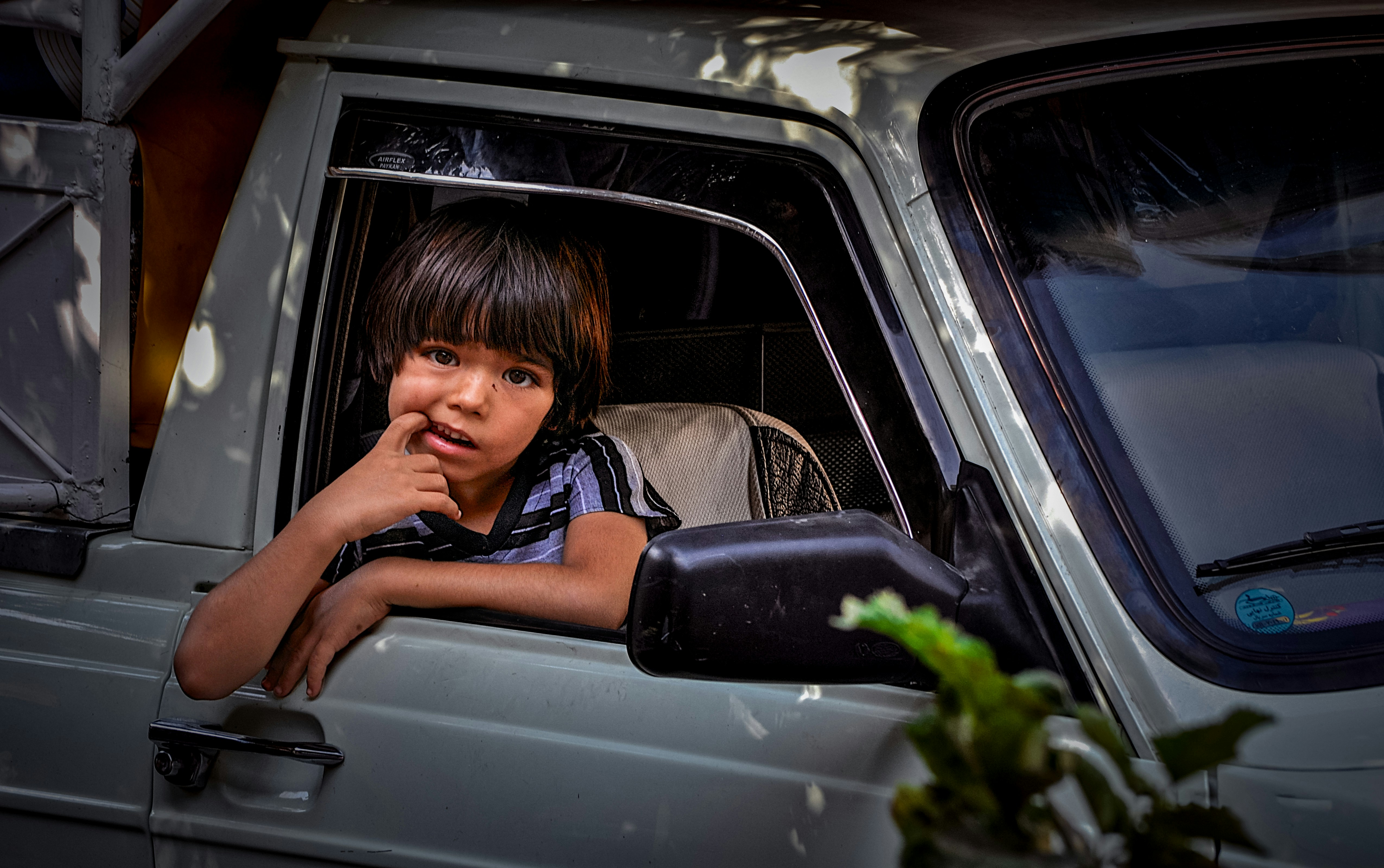 Quiet Gaze Through a Weathered Truck Window