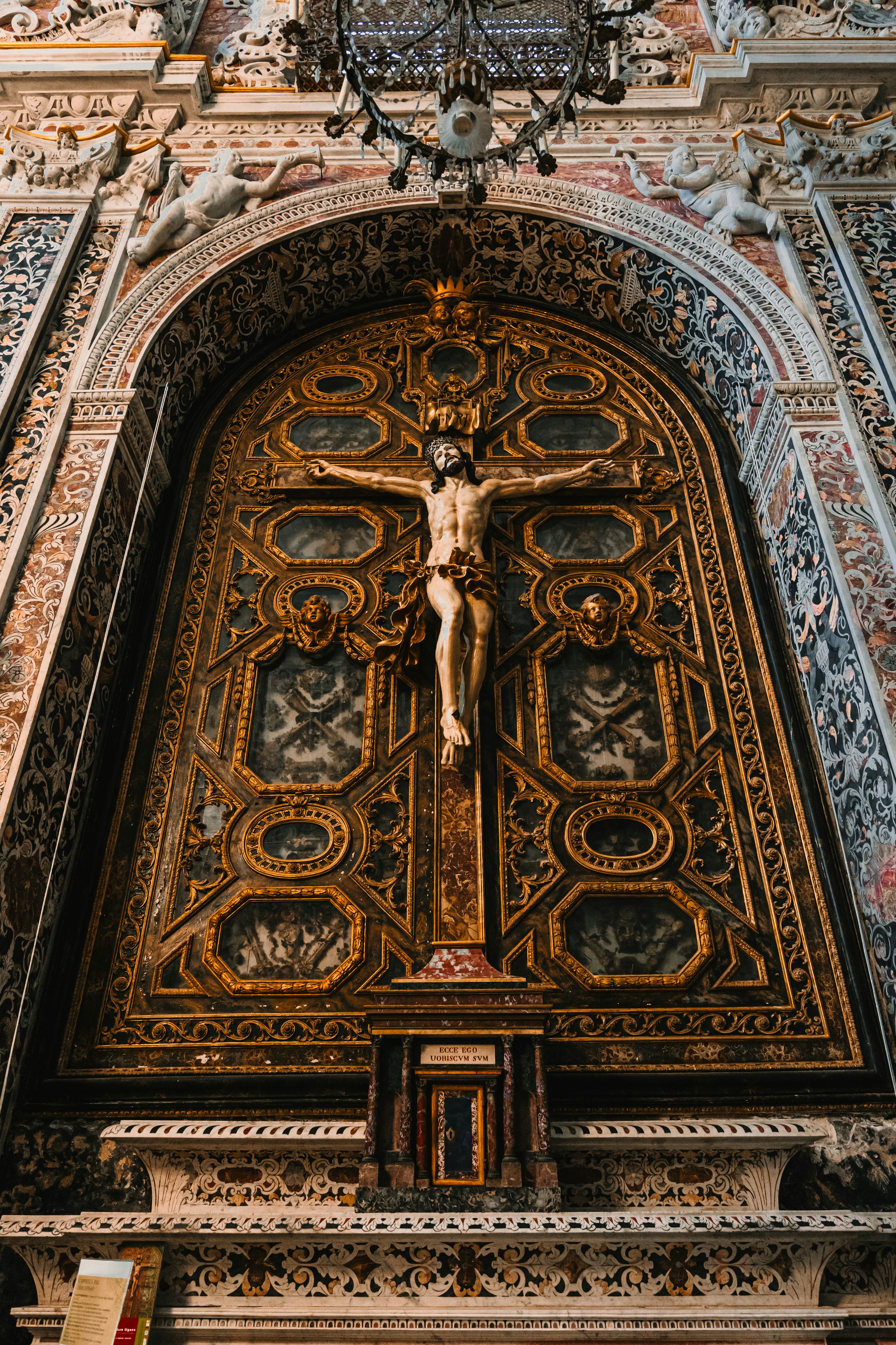 Crucifix at the Heart of a Gilded Baroque Doorway