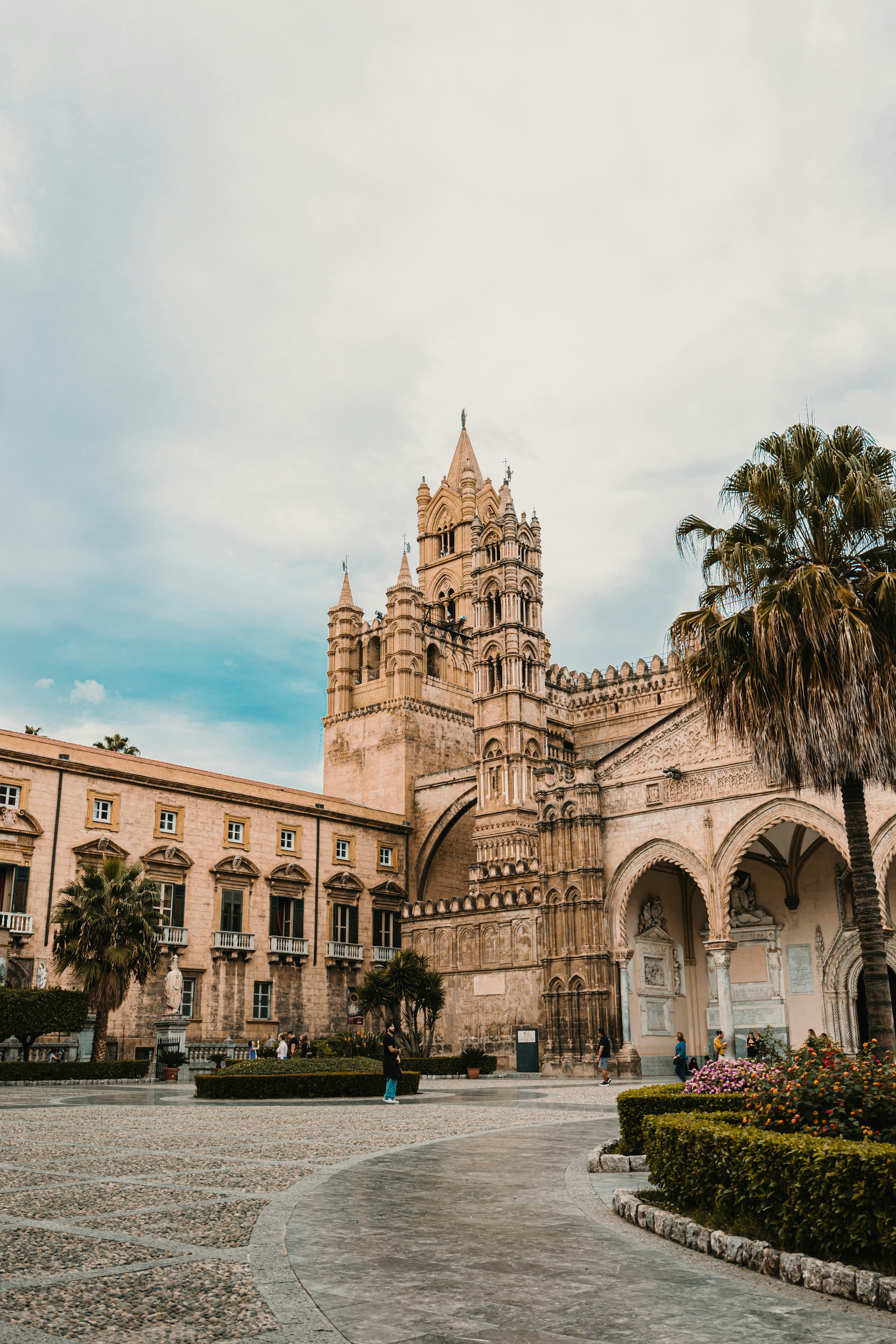 Towering Gothic Spine Over a Sunlit Mediterranean Courtyard