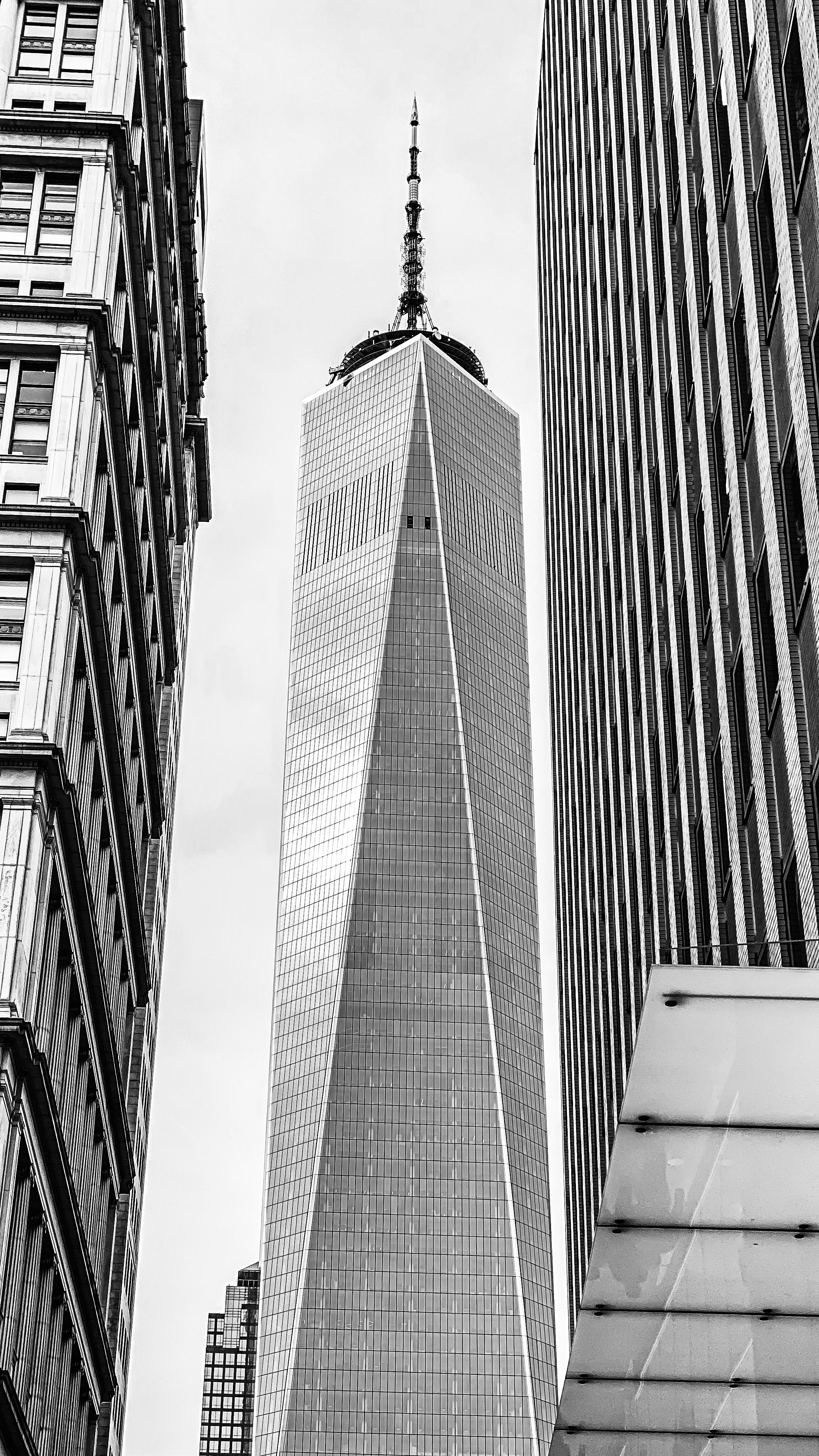 Spire Between Giants: One World Trade Center Rising Through a Narrow Urban Gorge