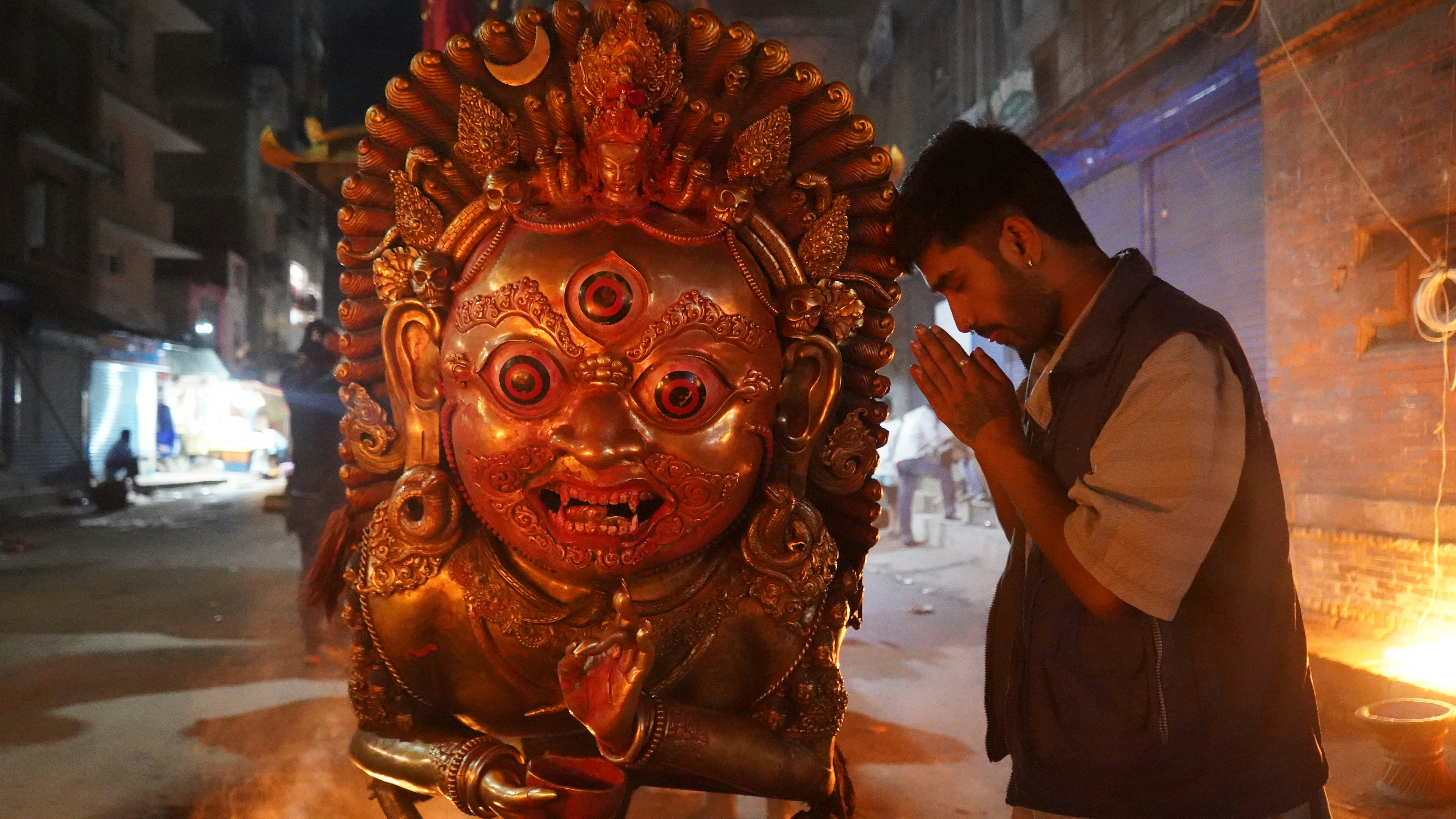 Gilded Guardian at Night: Prayer by a Street Shrine