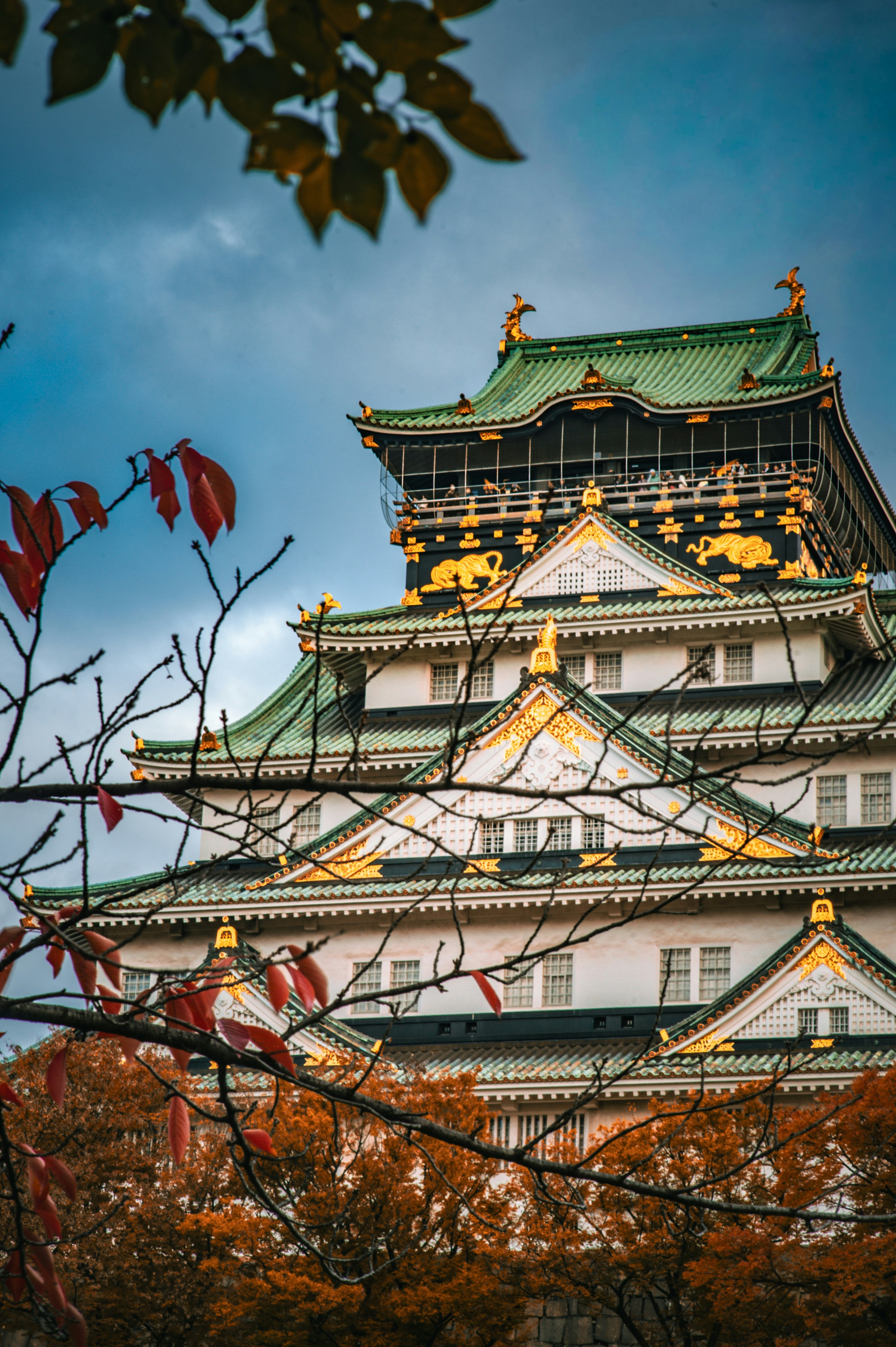Emerald Rooftops and Golden Ornaments: Autumn Light on a Japanese Castle