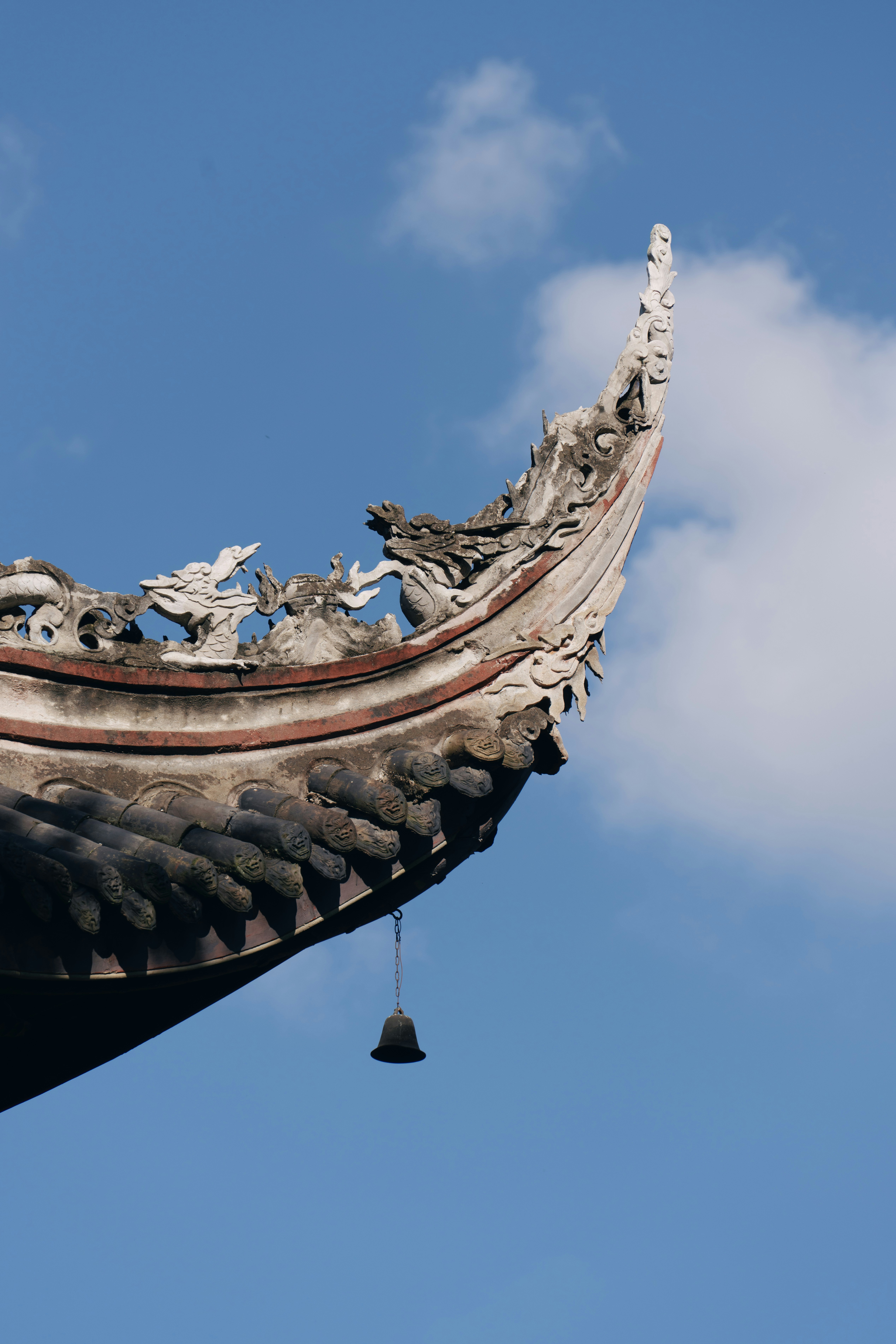 Ornate Temple Roof Crest Reaching Toward the Azure Sky