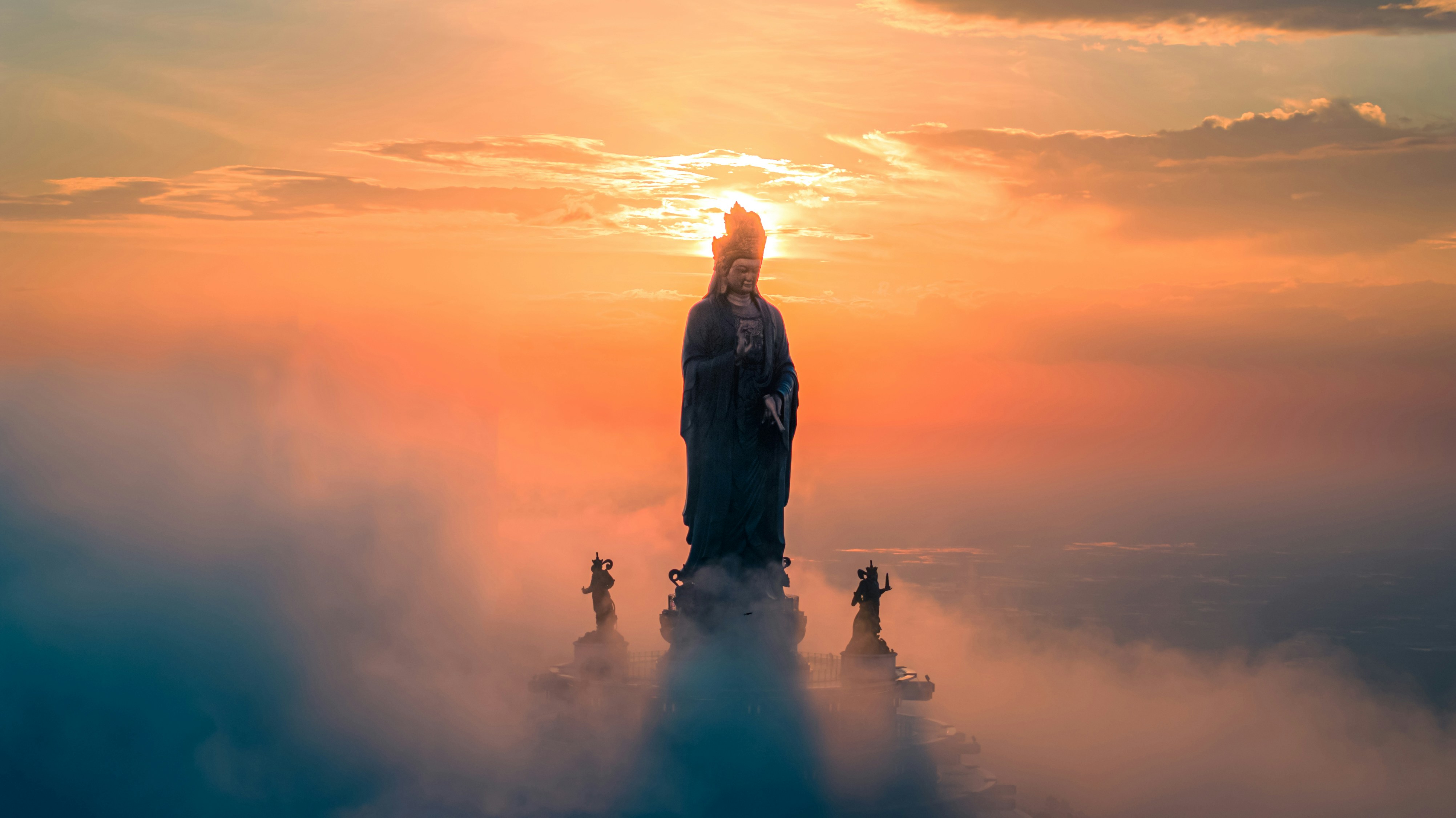 The Tay Bo Da Son Bodhisattva Statue admits the clouds on Ba Den peak, Tay Ninh, Vietnam