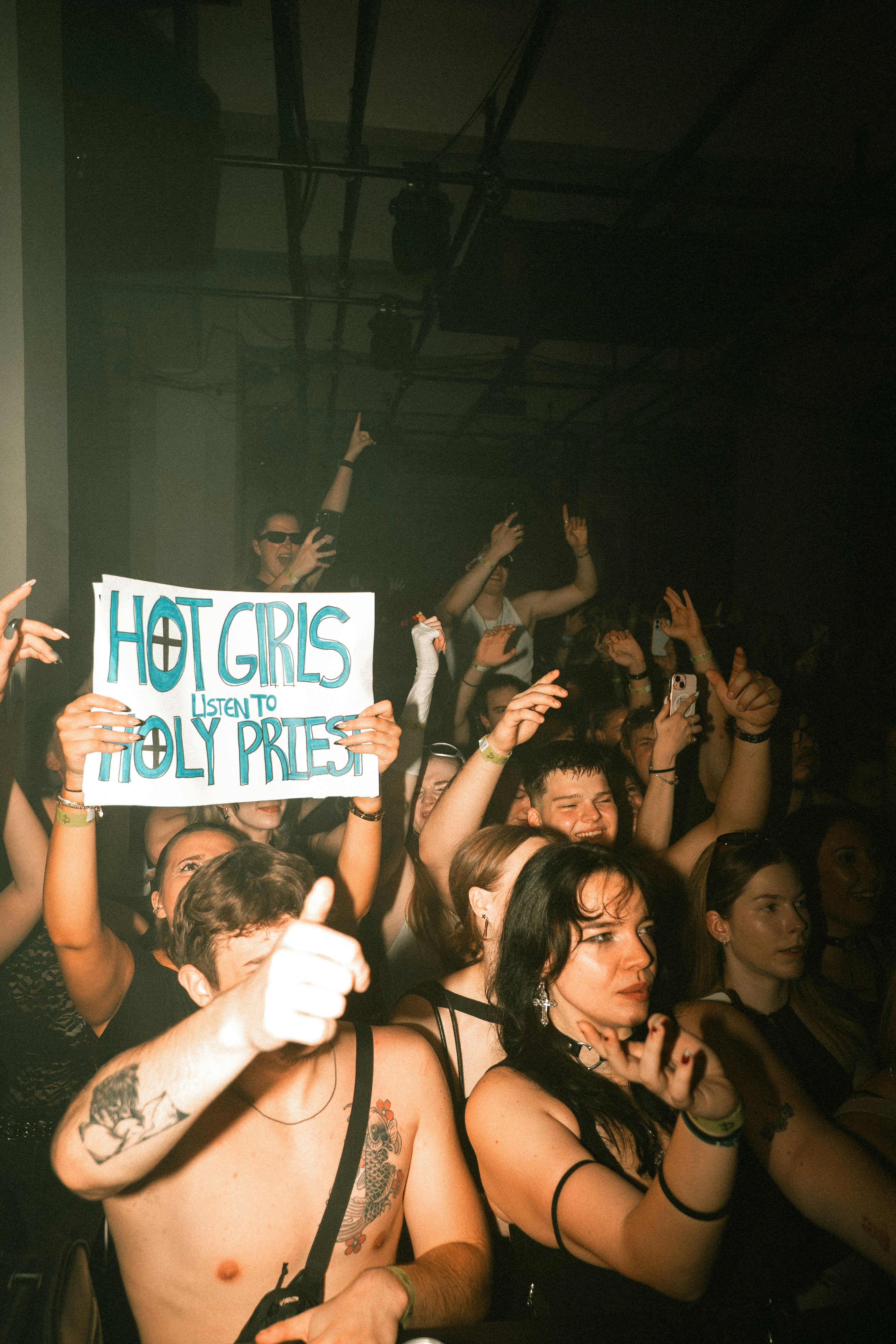 Neon Sign Anthem Rises from a Packed Club Crowd
