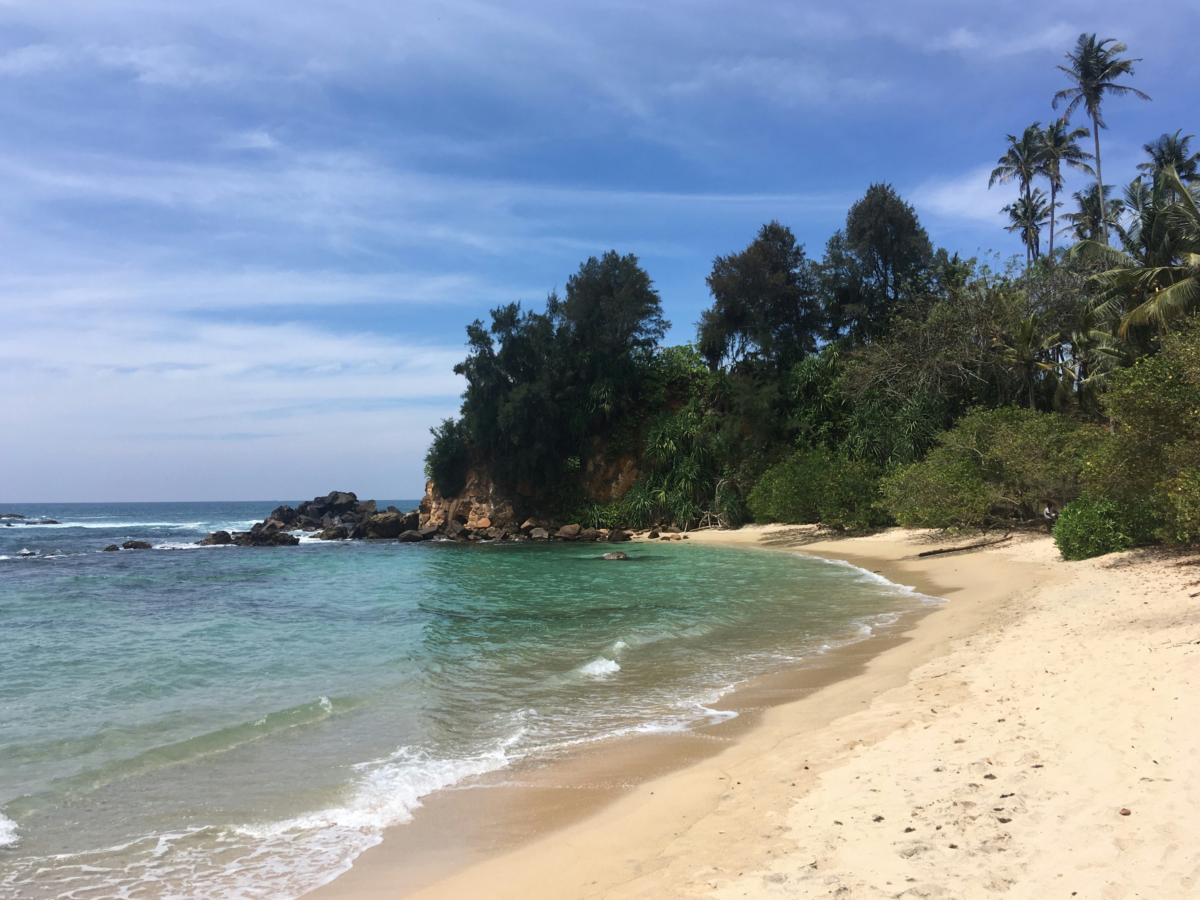 Tropical beach paradise with turquoise water near Ahangama, Southern Sri Lanka, March 2019
