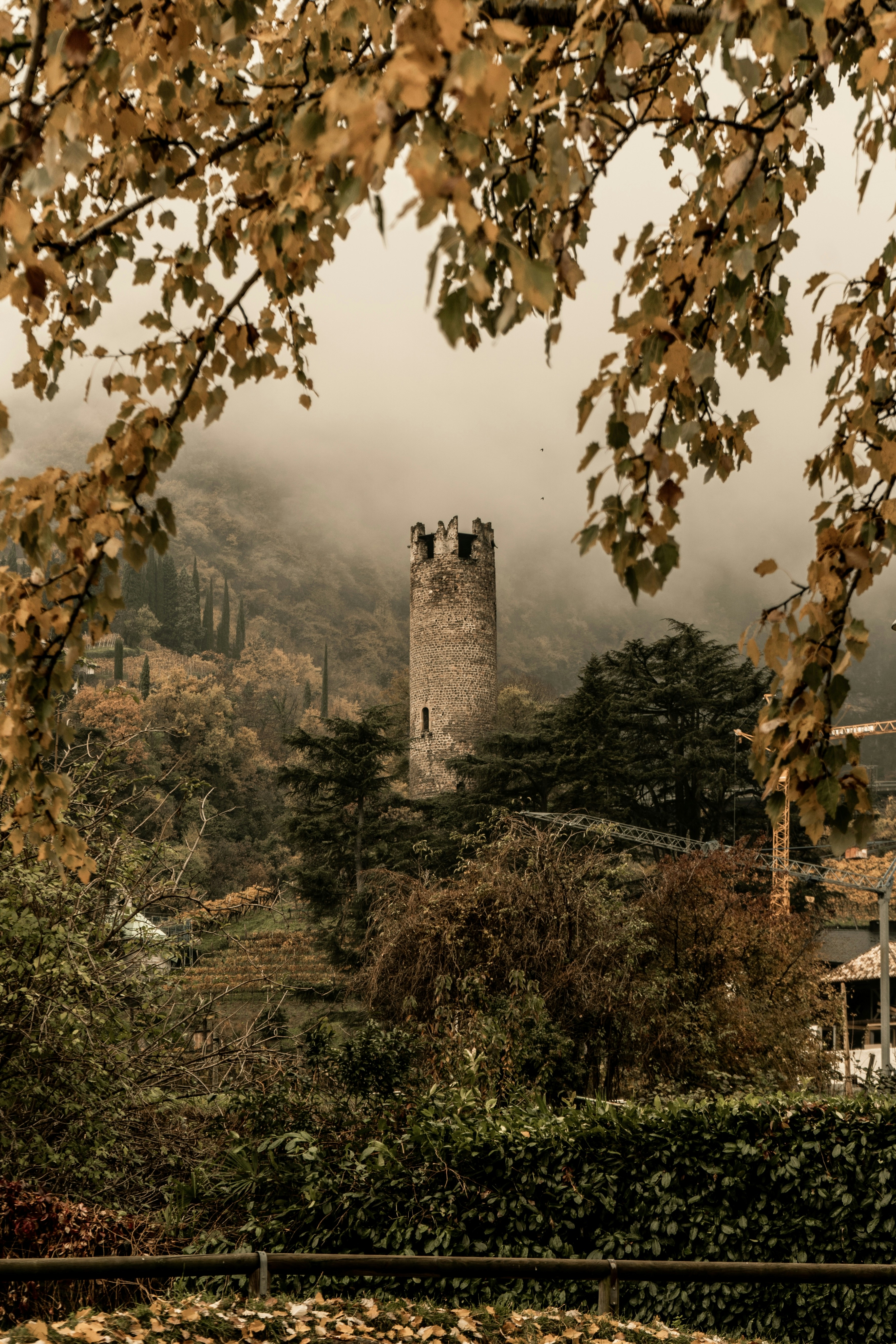 Autumn Keep: Tower Rising Through Layered Fog