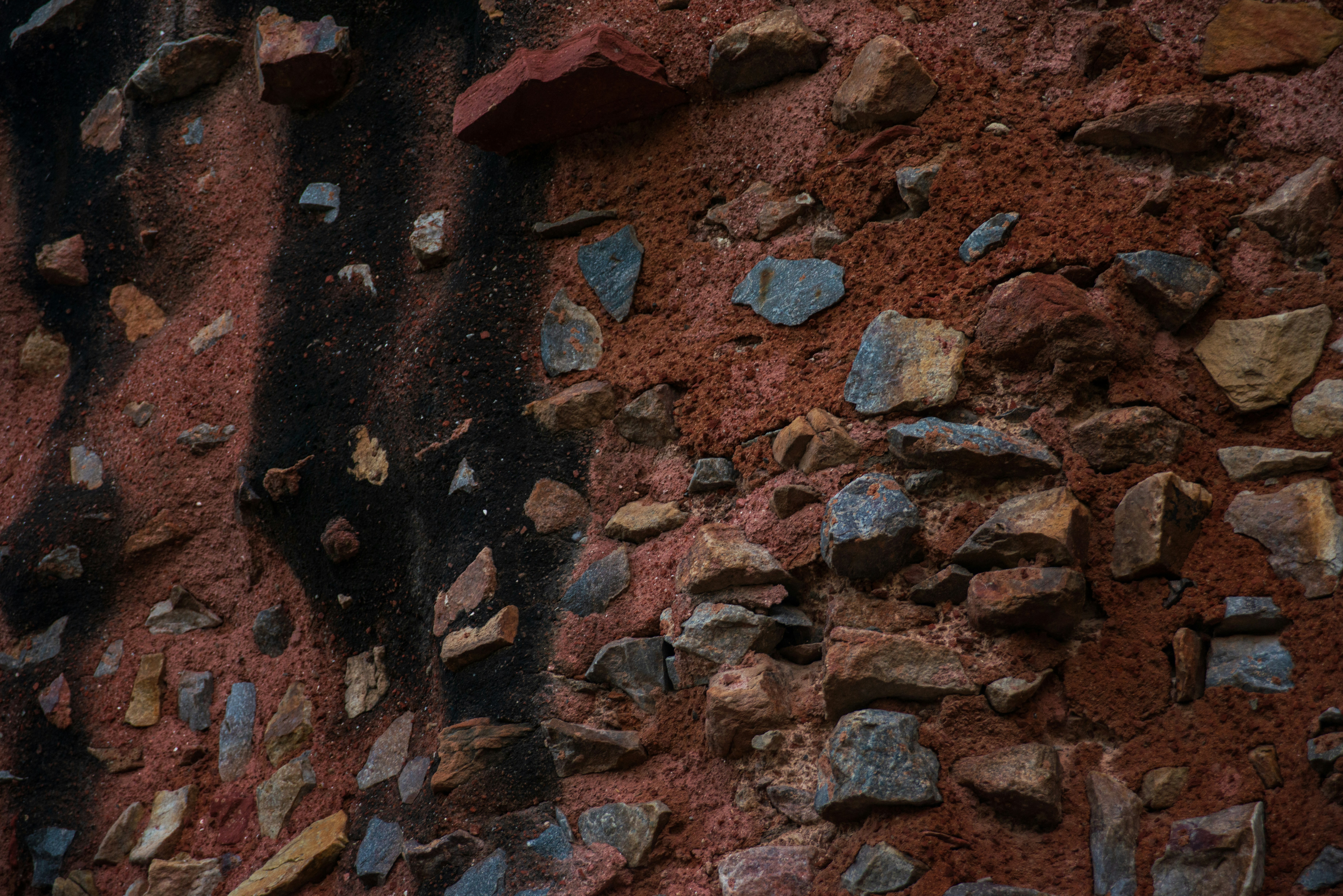 Red Stone Wall filled with rocks