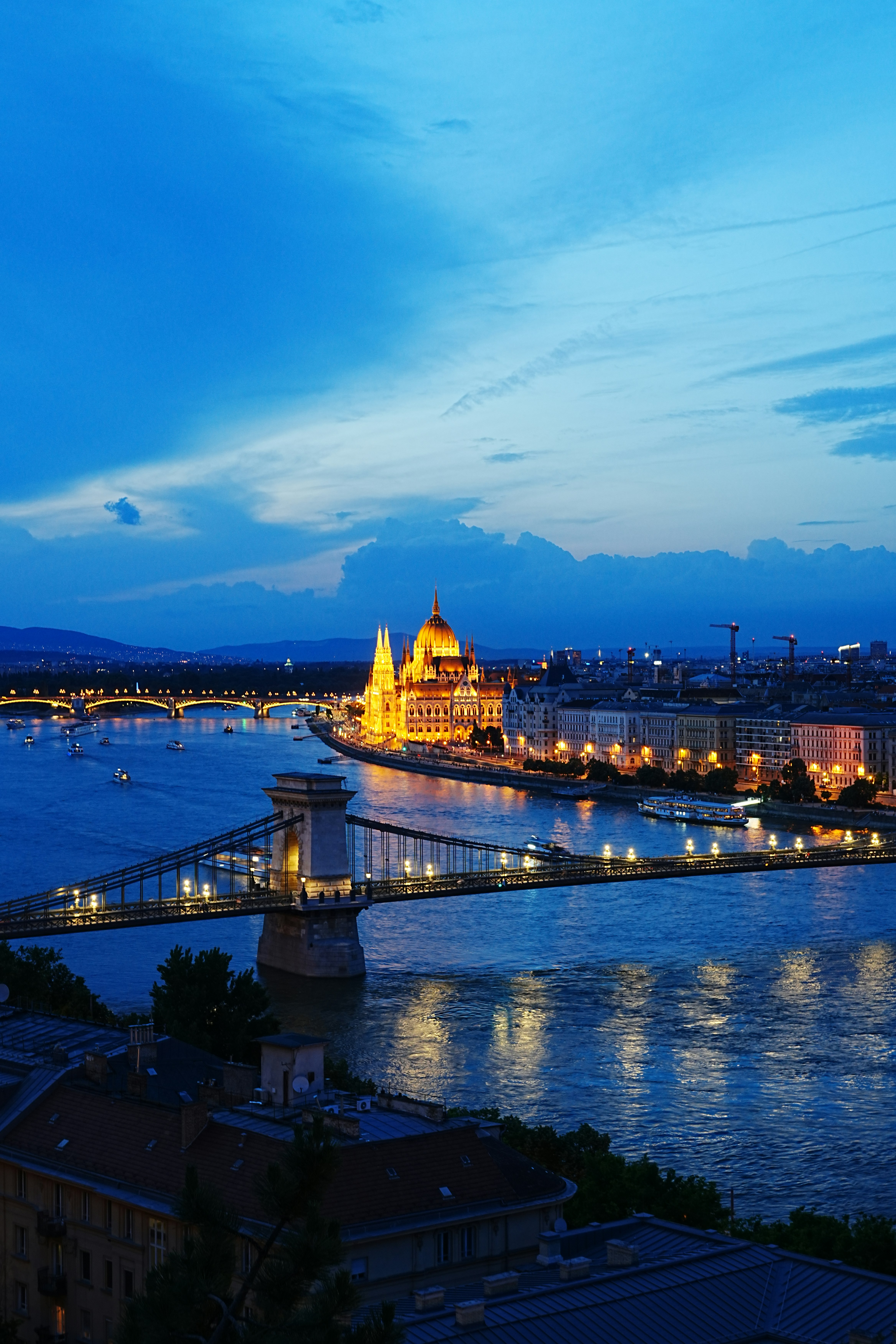 Dusk Over the Danube: Illuminated Parliament and Chain Bridge in Budapest