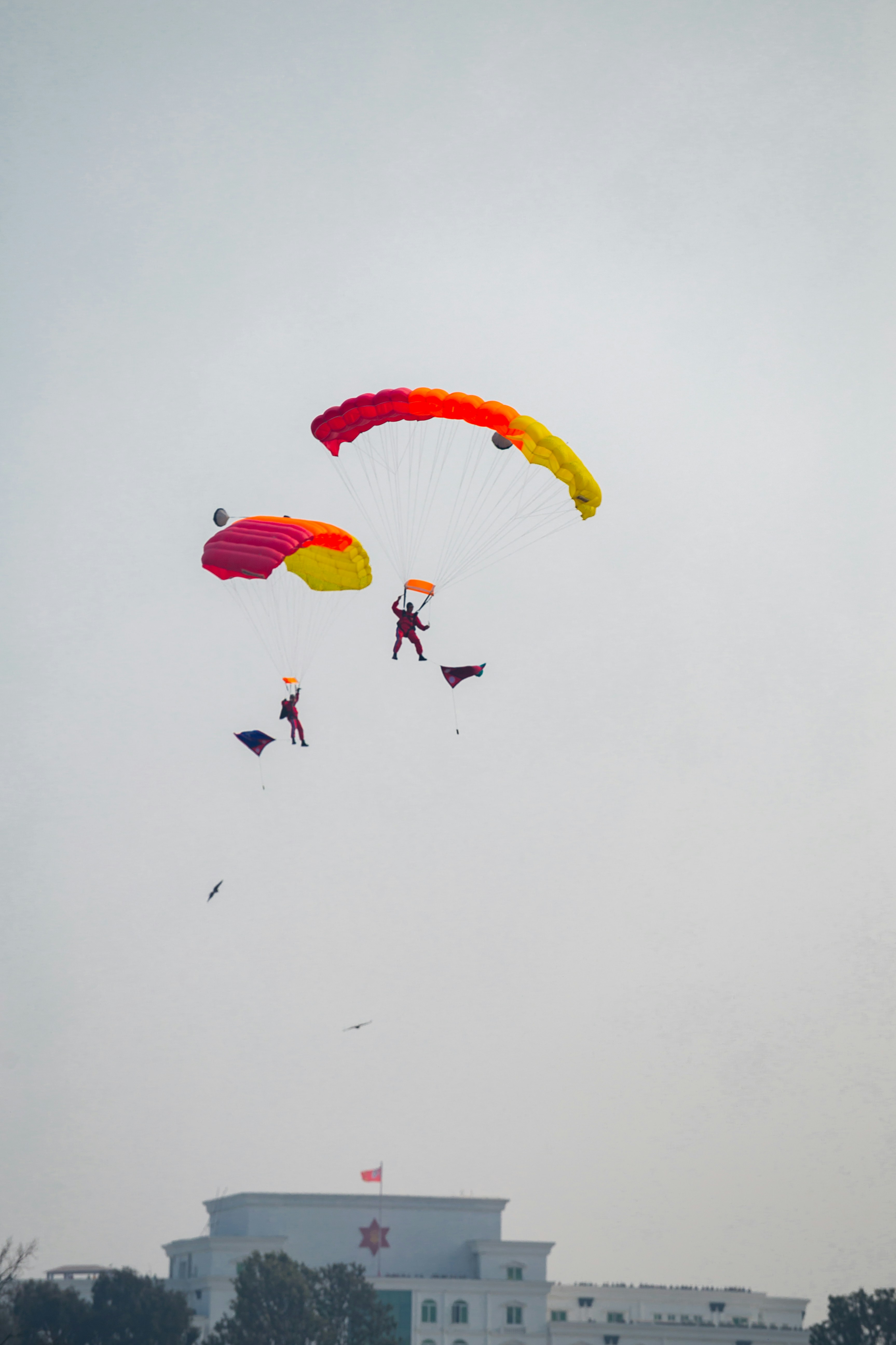 Nepali Army Paratroopers Jumping from the Sky at Kathmandu , Tudikhel in Nepali Army Day