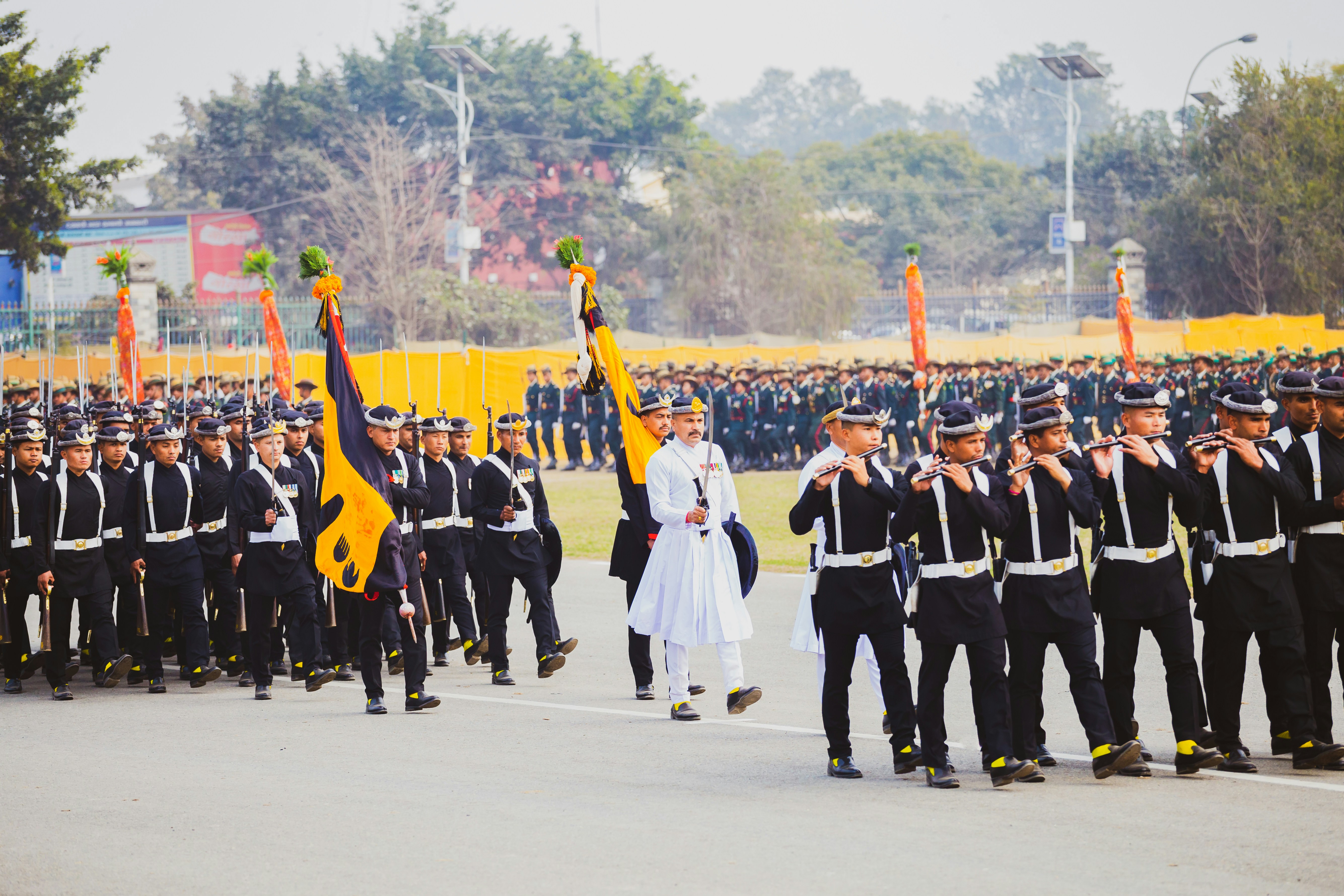 A marching band in uniform with flags photo – Free Military Image on ...