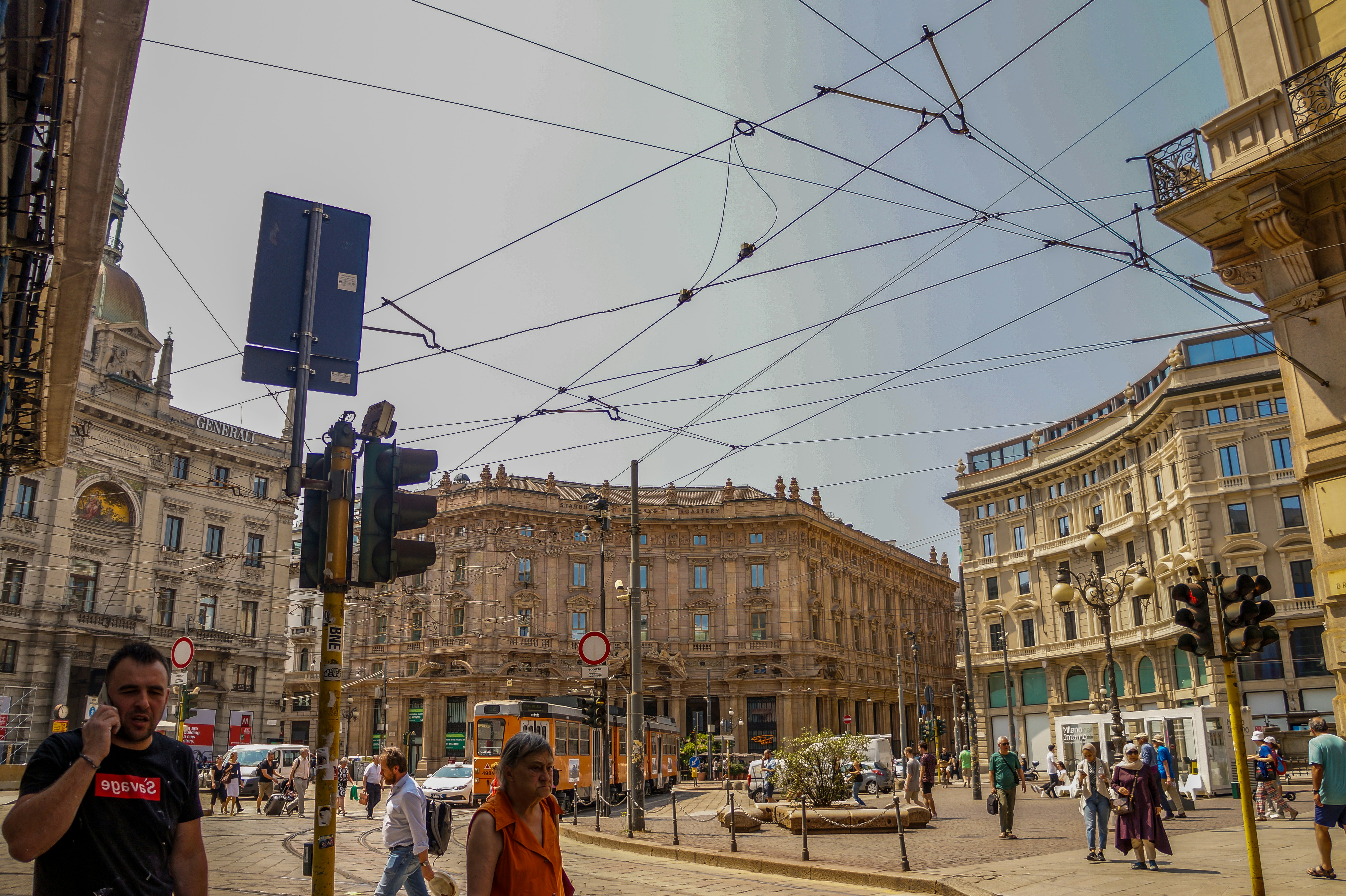 Wired Sky over the Sunlit European Piazza