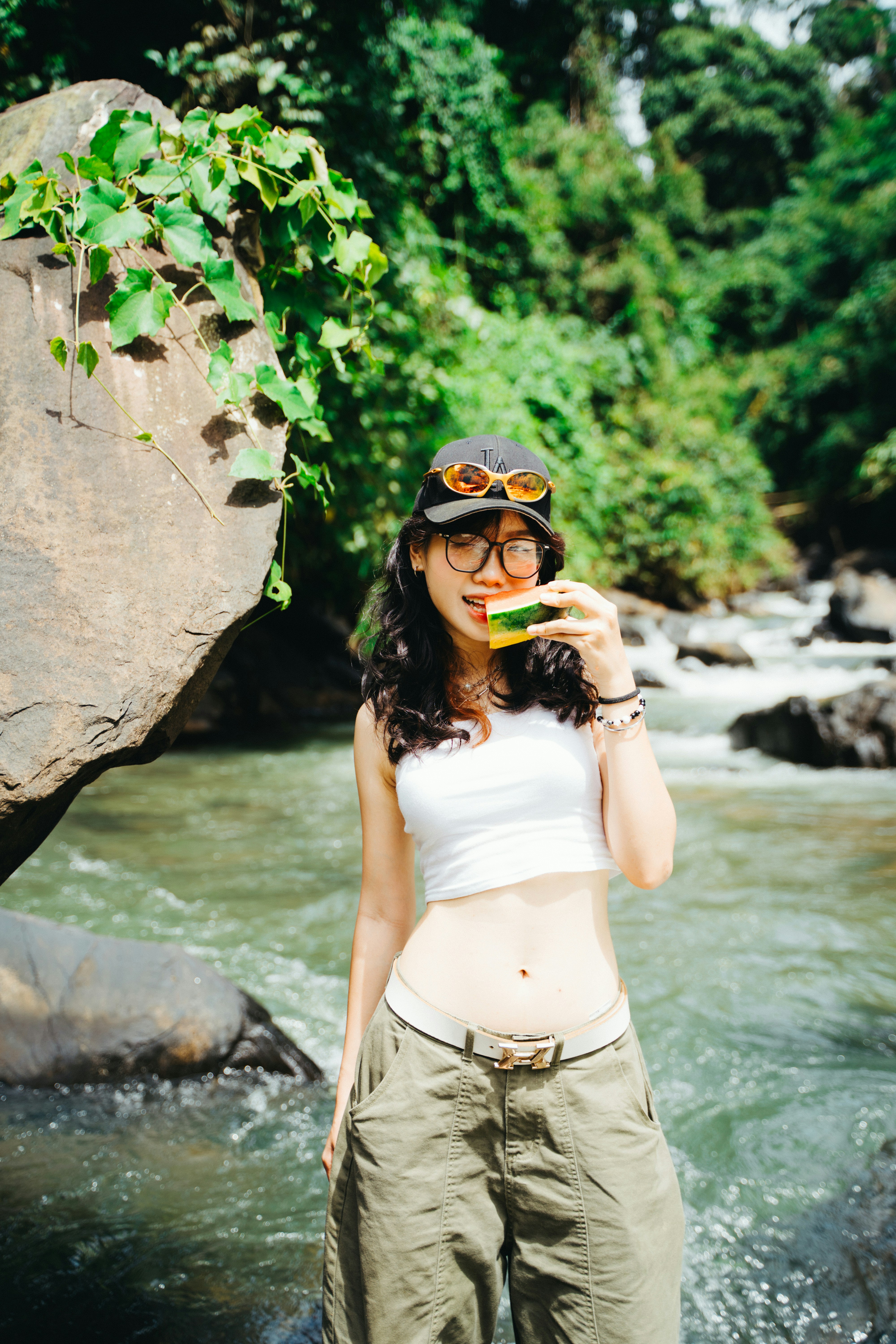 Emerald Riverbank Portrait: A sun-kissed moment by flowing turquoise water