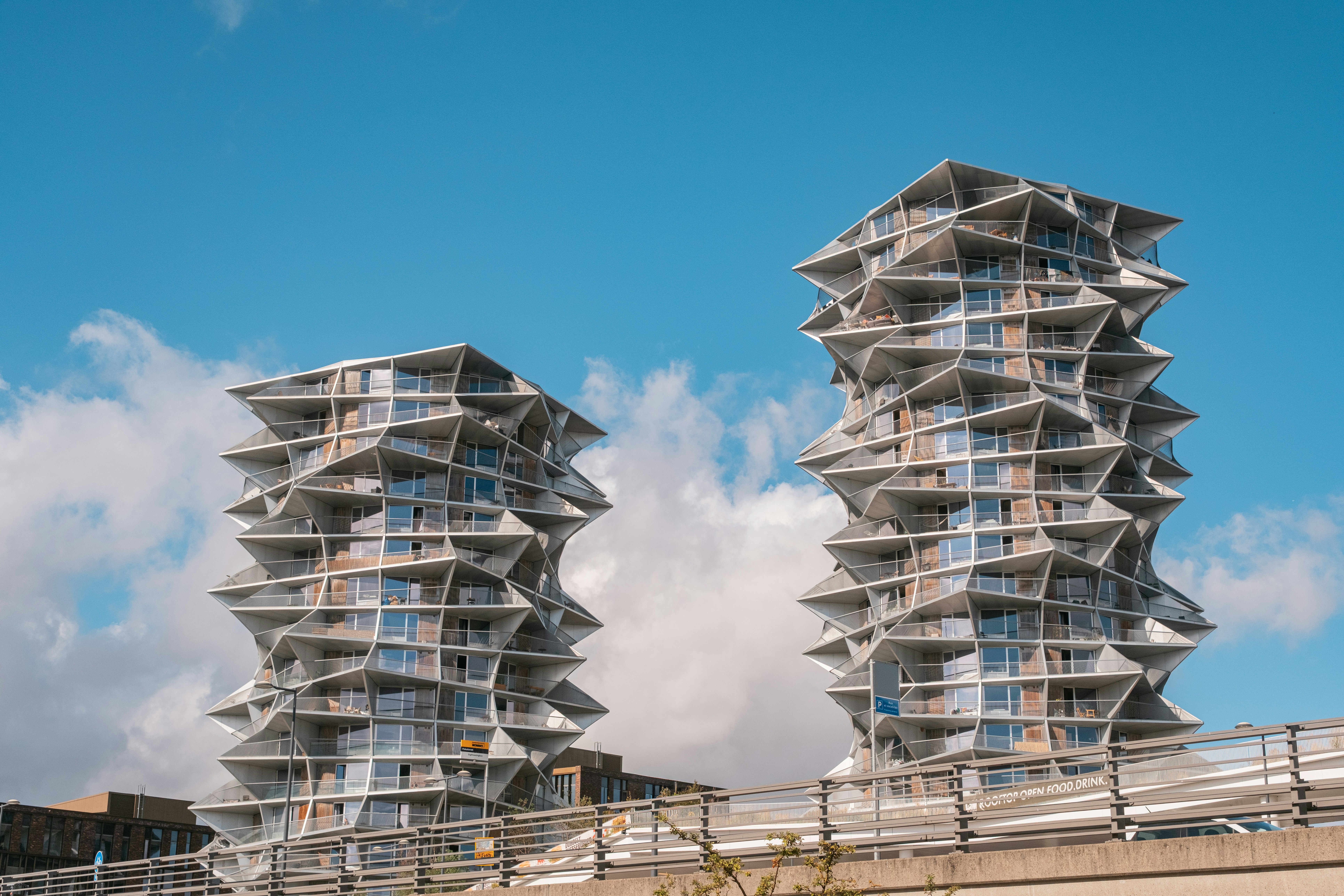 Two modern apartment buildings with unique geometric designs. photo ...
