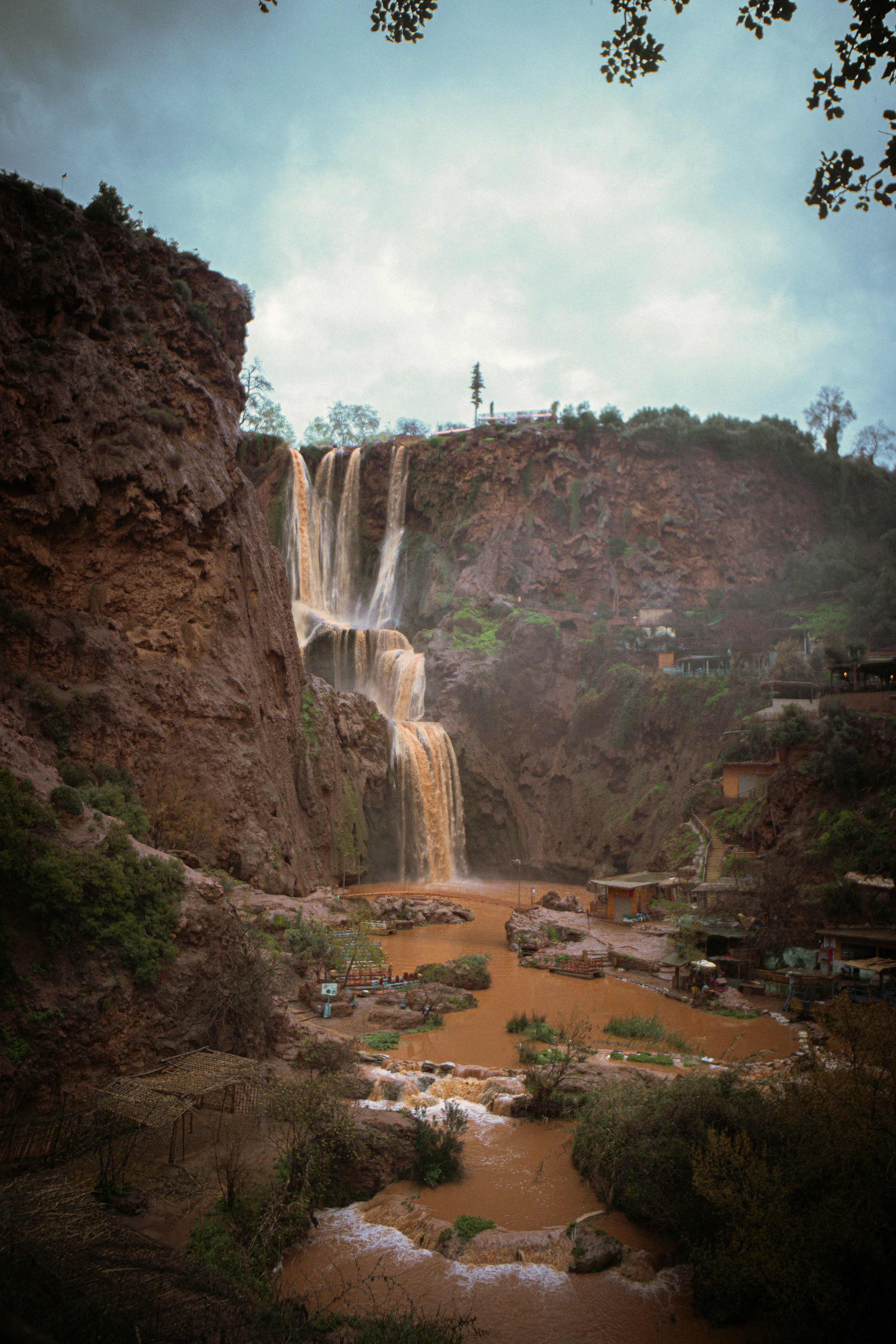 Rust-Colored Cascades in a Cliffside Gorge