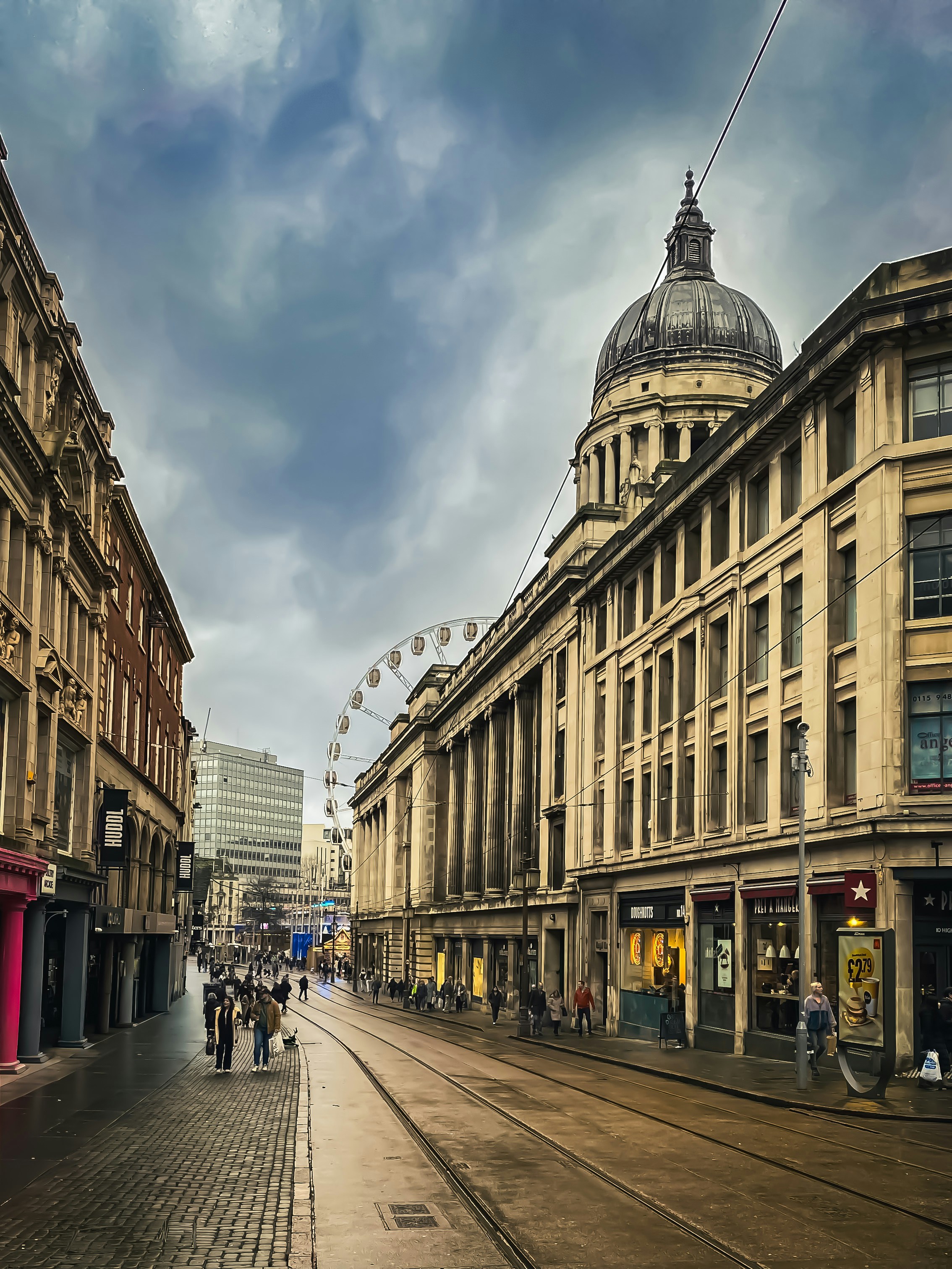 Dome and Rails: A City Street Framed by Architecture and a Distant Ferris Wheel