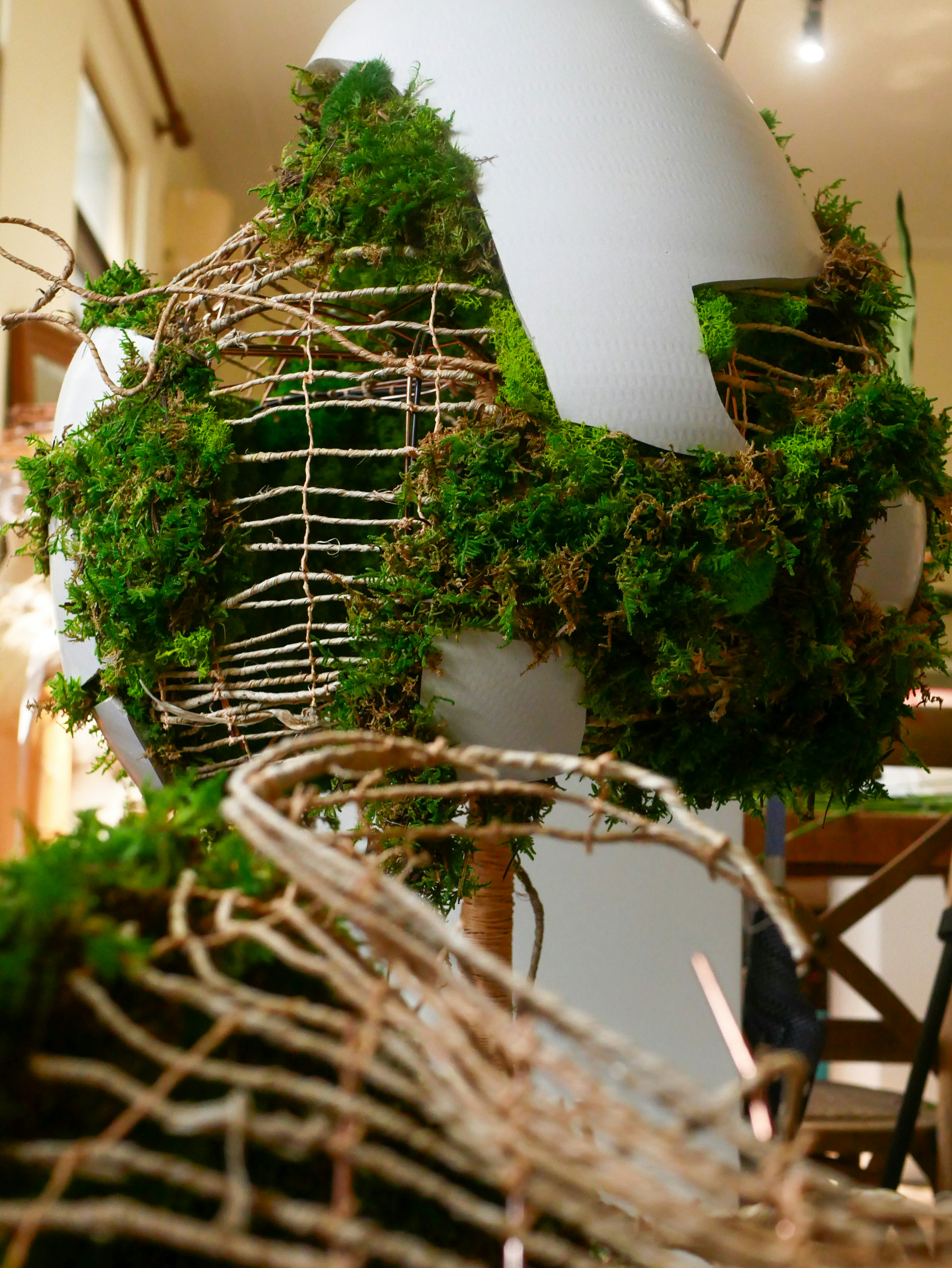 Kinetic Nest: Moss-Covered Sphere in a Woven Skeleton
