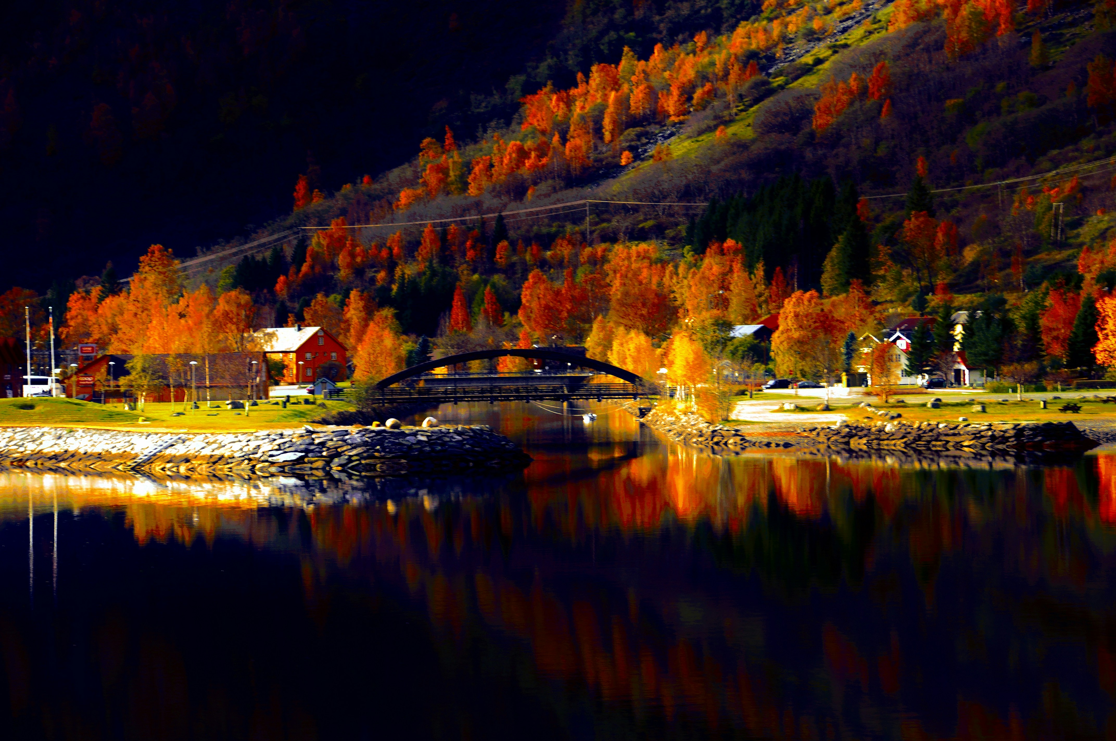 Ember Reflections: The Autumn Bridge Over a Quiet Lake
