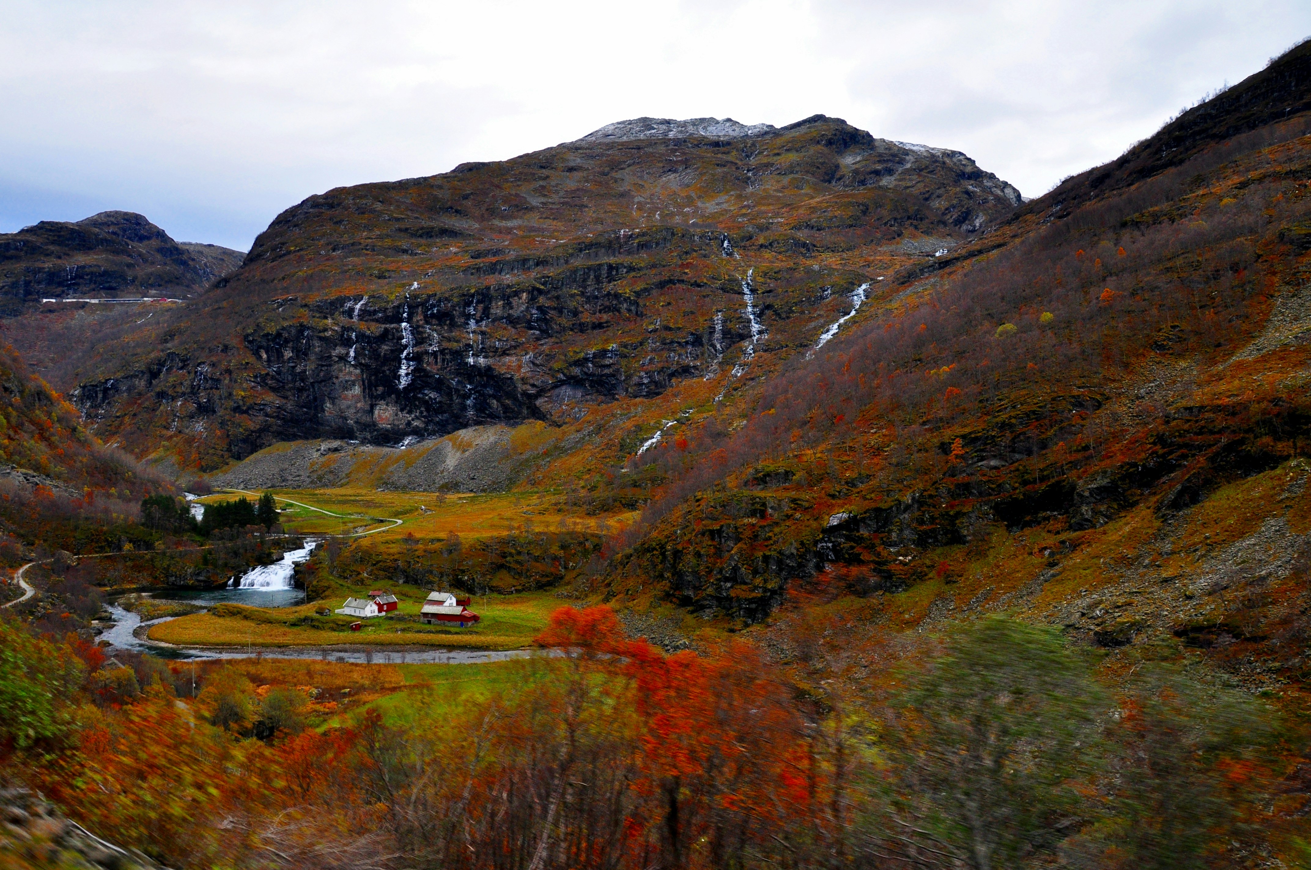 Crimson Veil Over a Highland Valley