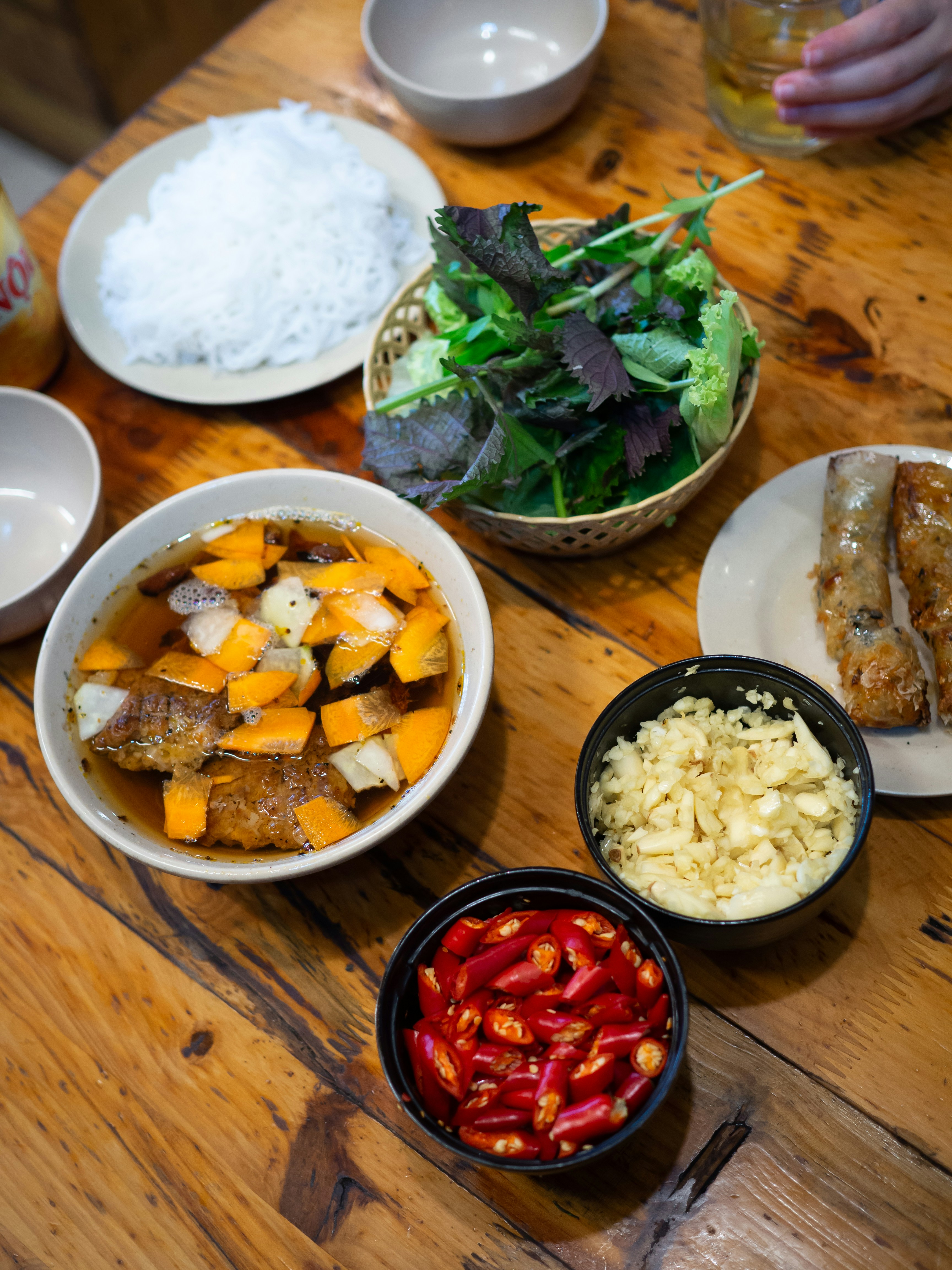 Autumn Braise on a Wooden Table: Golden Cubes, Fresh Greens, and Fiery Chili