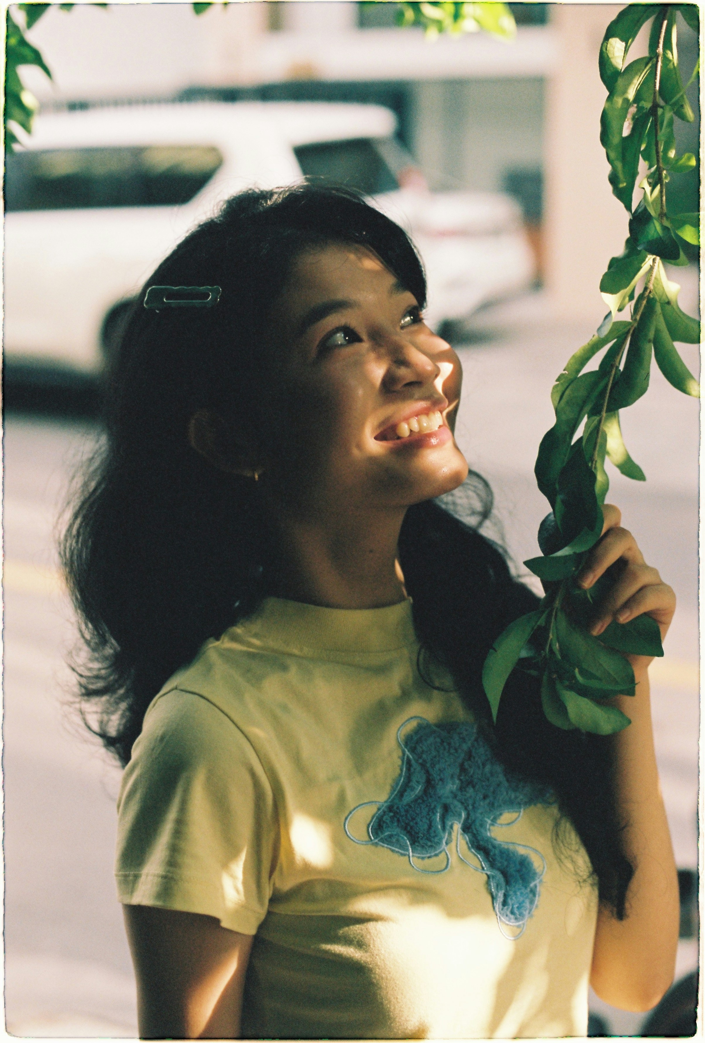Sunlit Smile Under a Leafy Frame