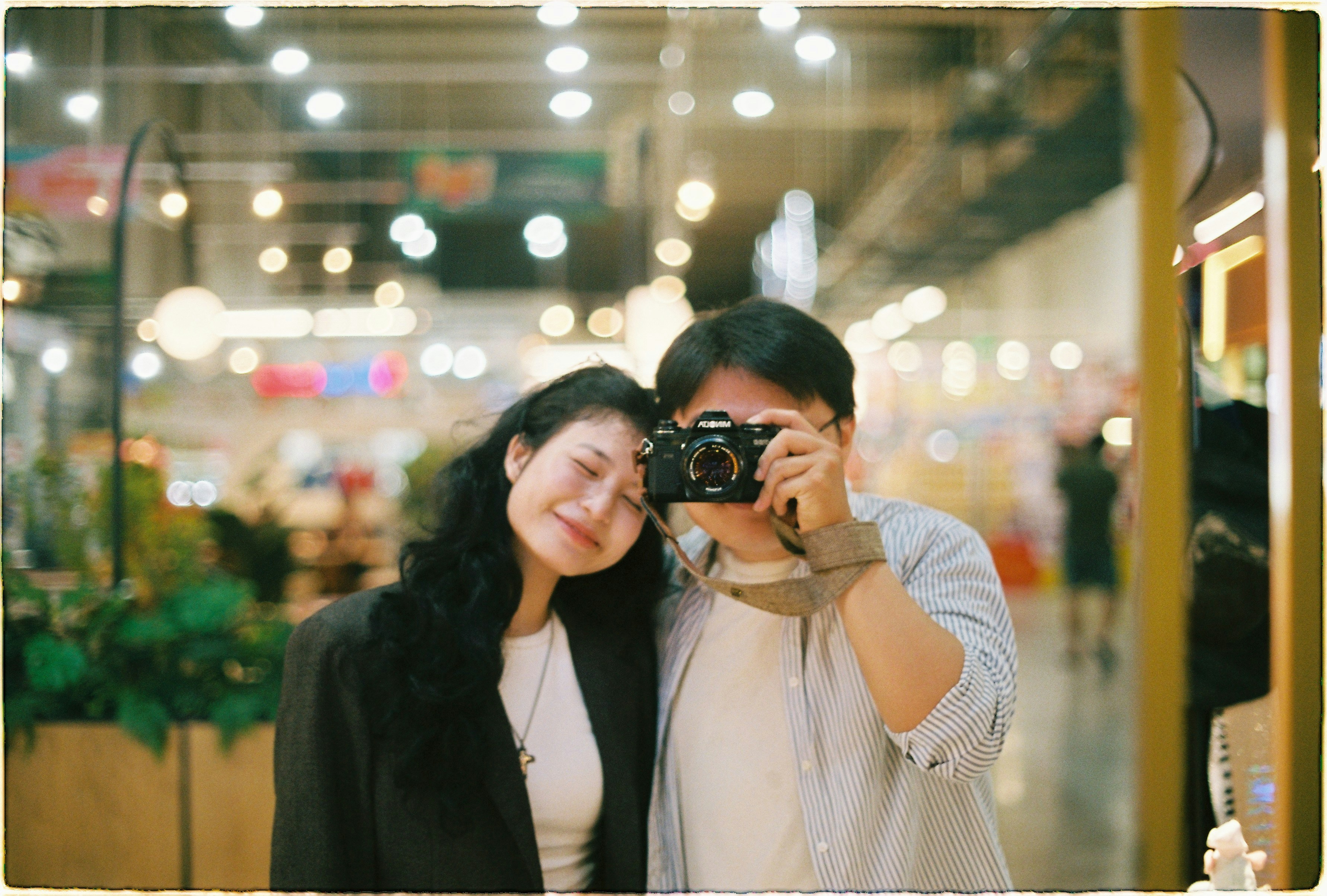 Glow in the Glass: A Mall Selfie Between Smiles