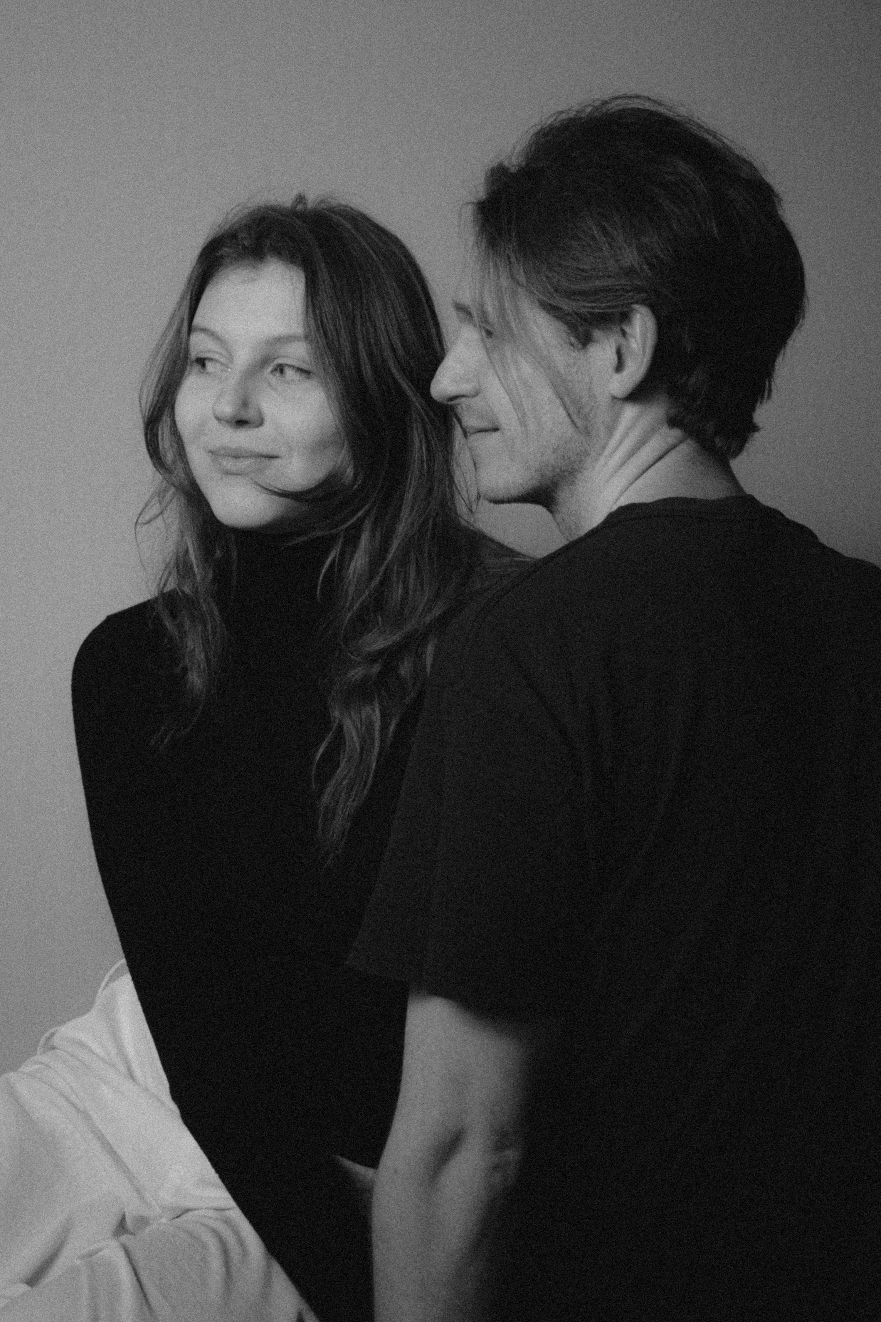 Monochrome Moment: A Subtle Smile Between Two Faces