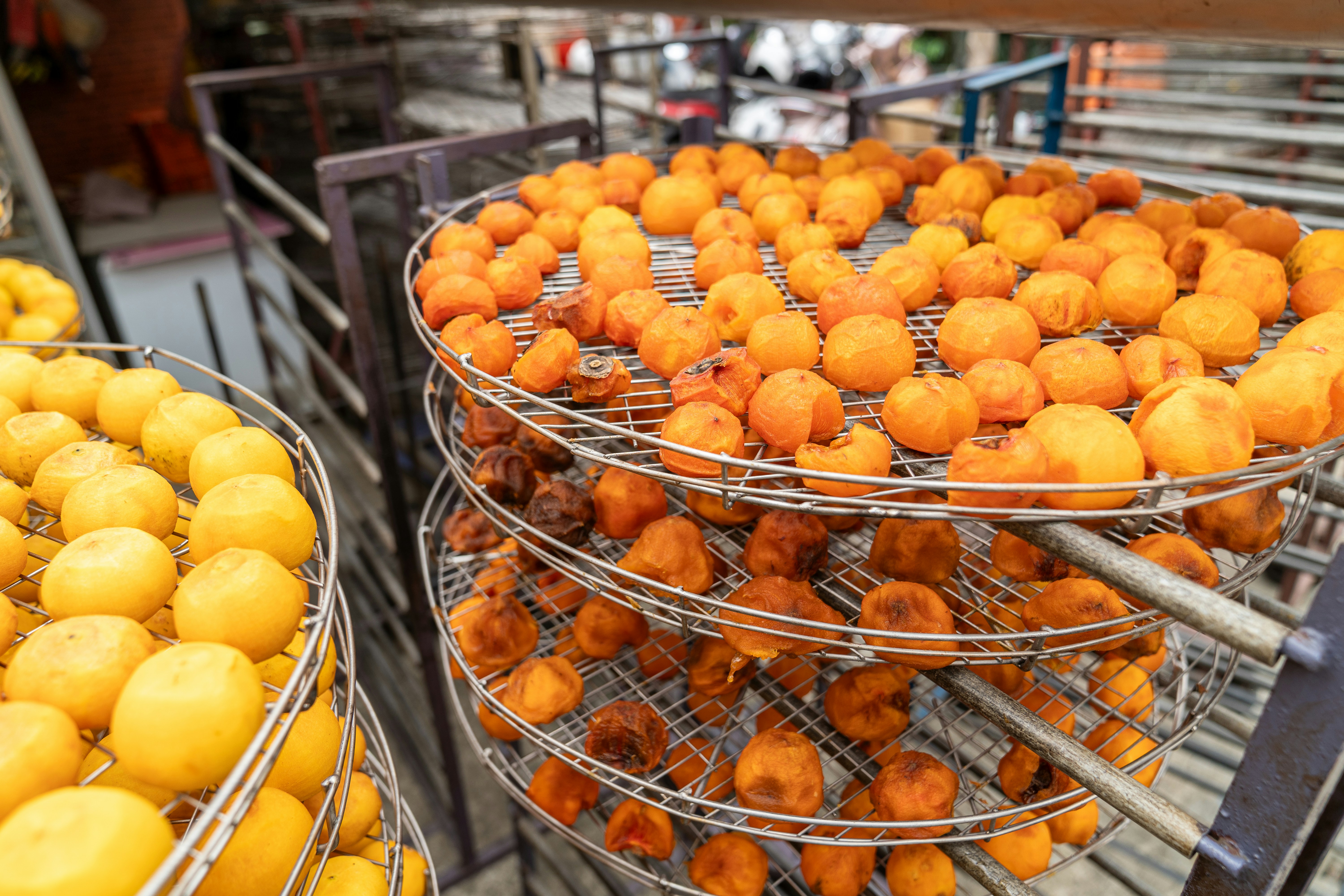 Promenade of Orange Orbs: Market Racks Brimming with Citrus