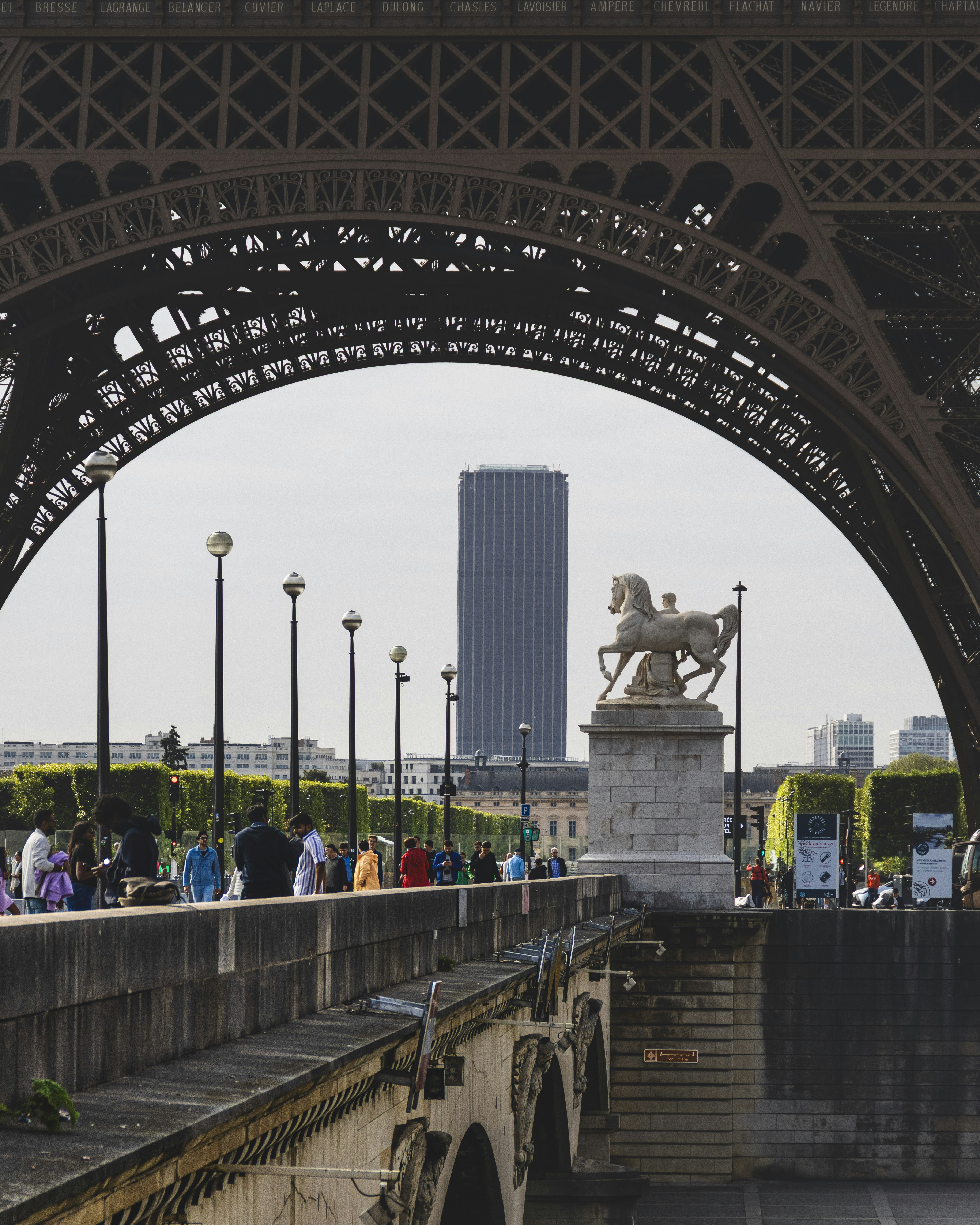 Under the Iron Arc: A Horse Statue Guarding the Seine