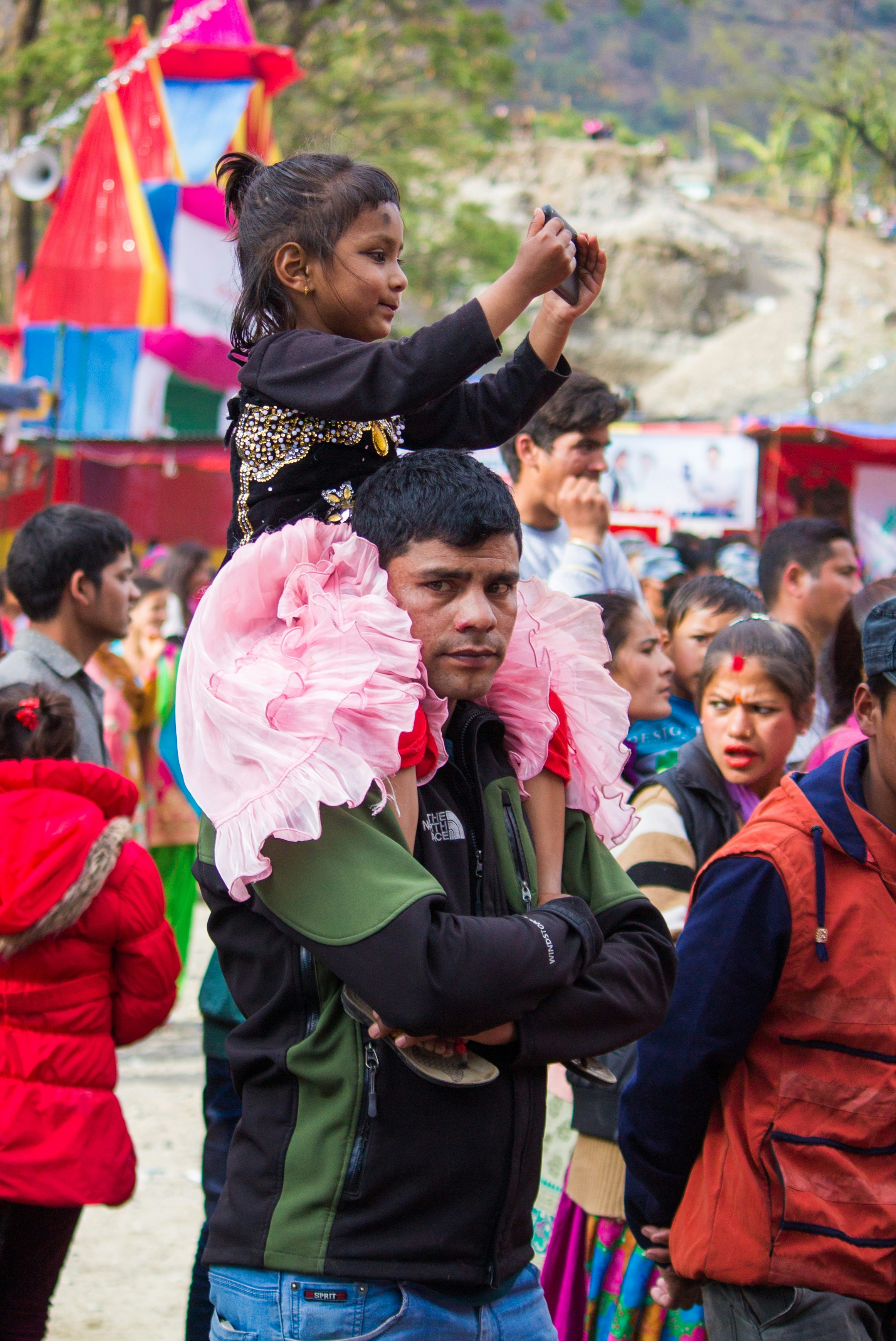 On-Shoulder Wonder in a Vivid Festival Crowd