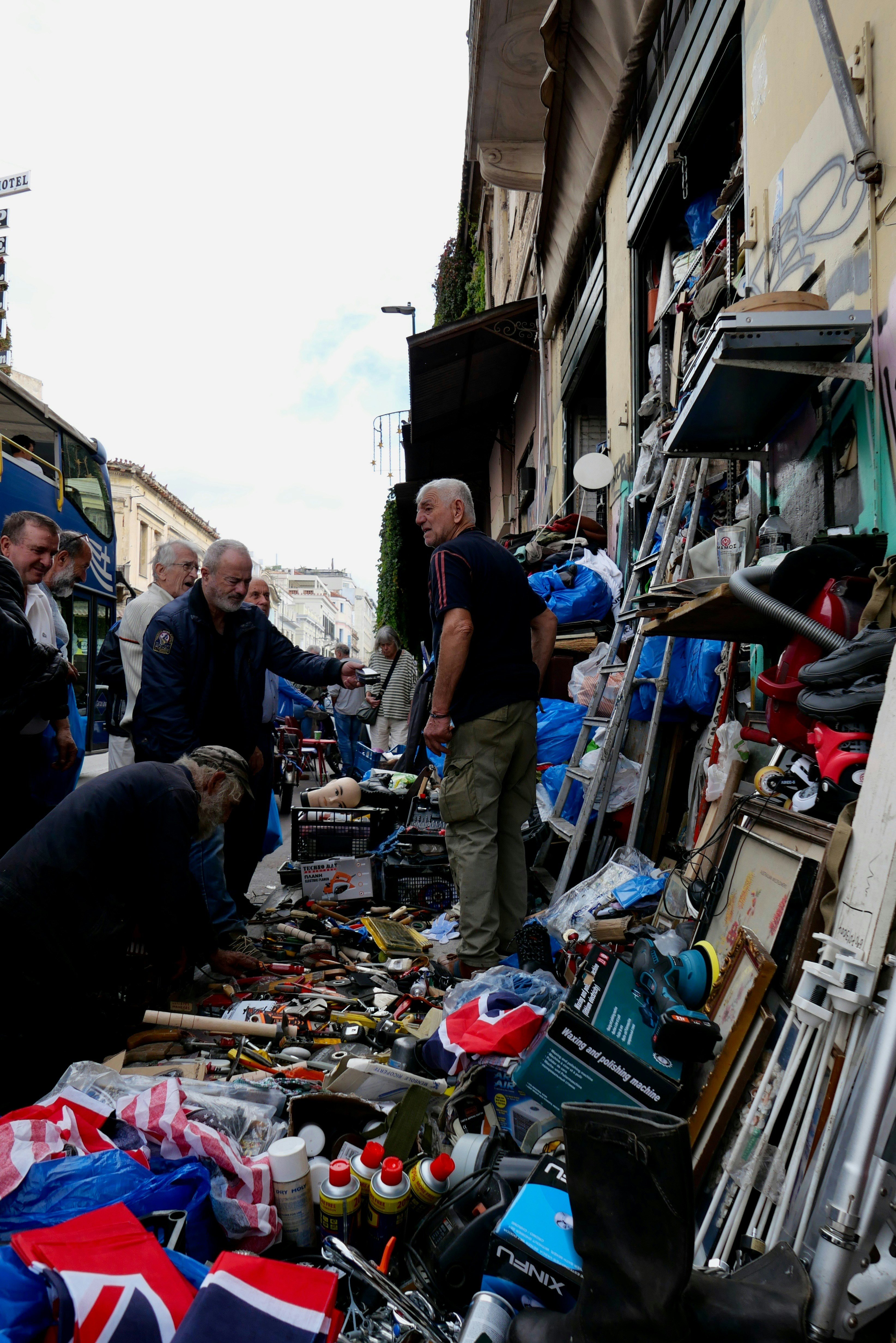 People browsing items at an outdoor market stall photo – Free Tools ...