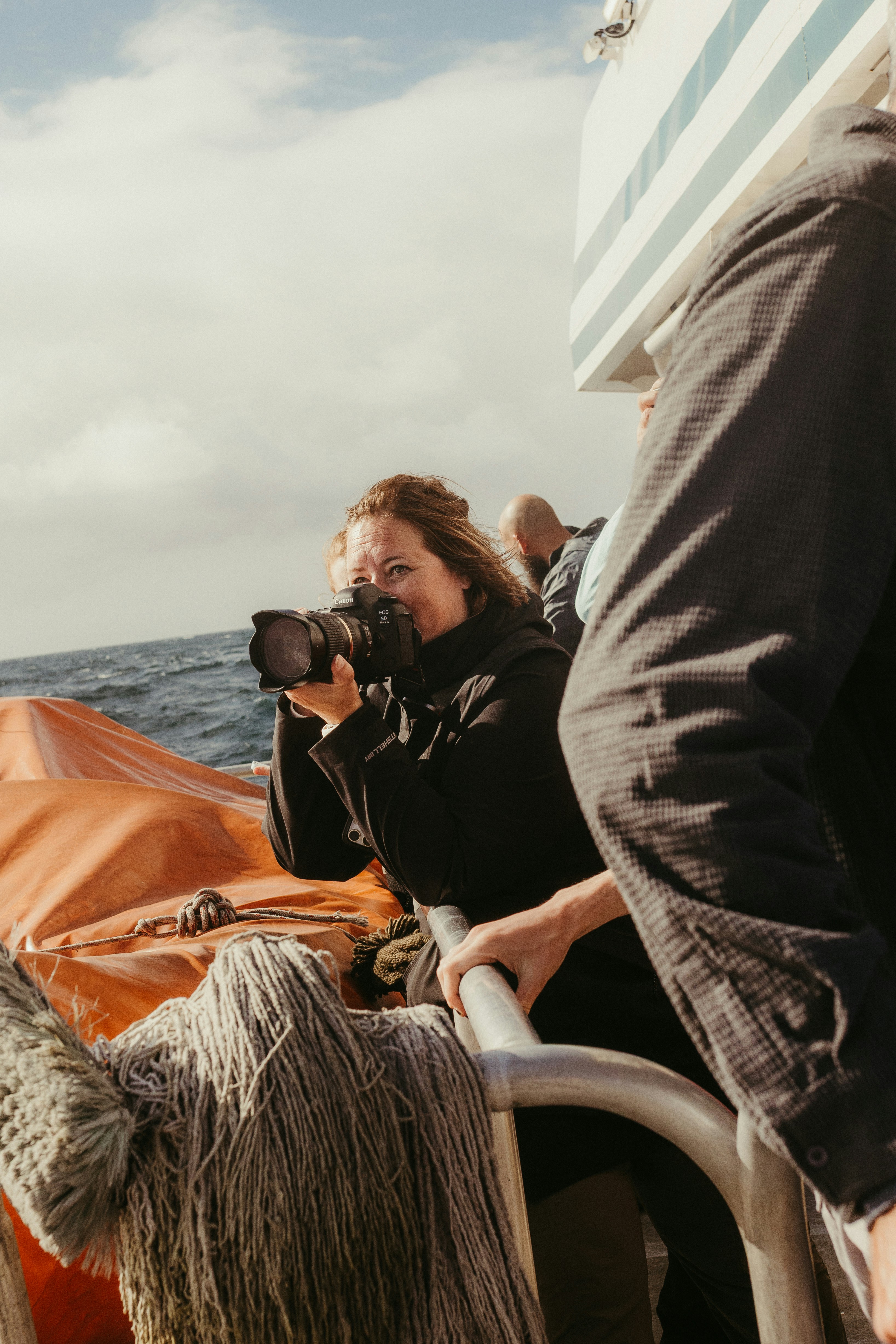 On Deck, a Photographer Captures the Moment Amid Ocean Winds