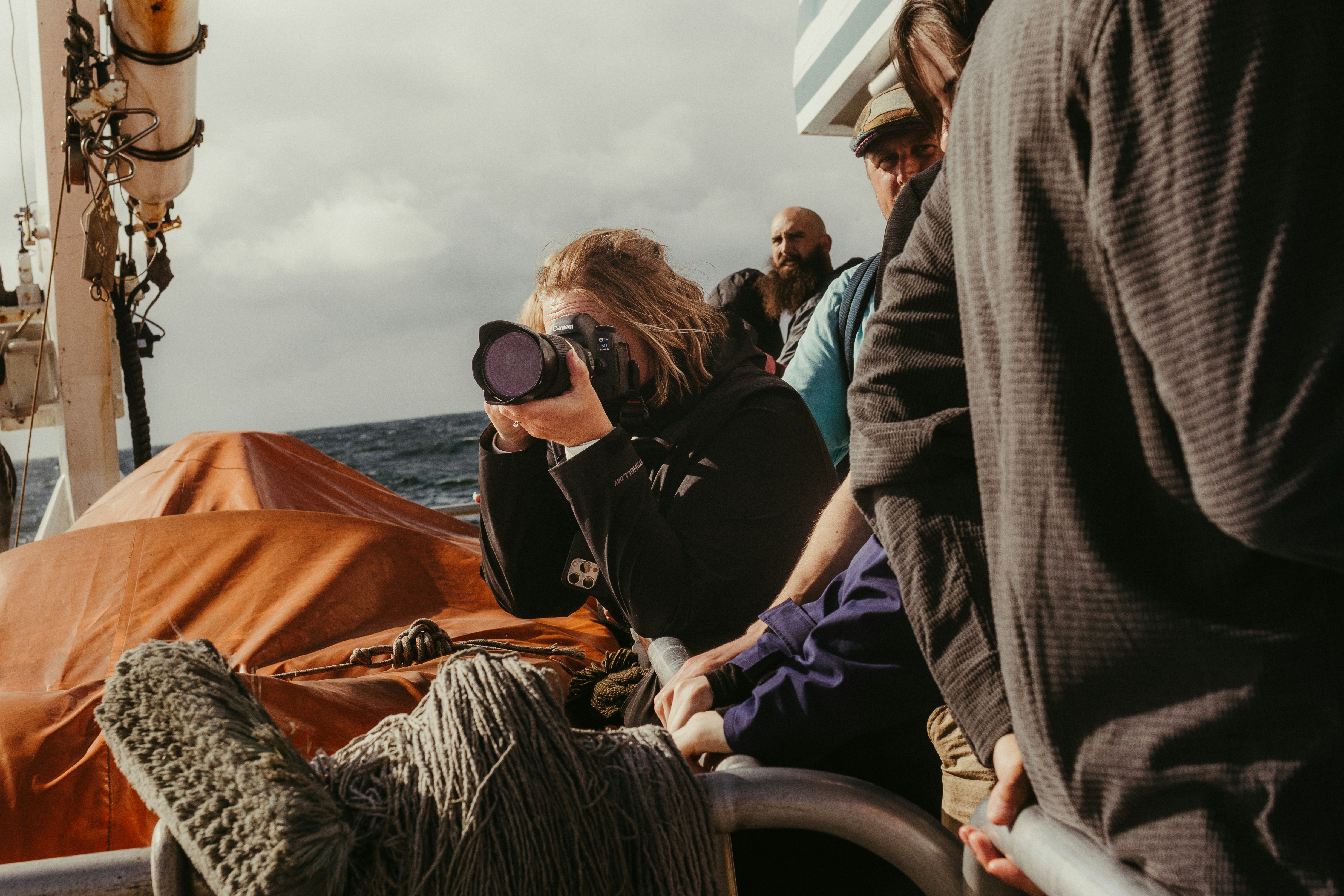Deckside Focus: The Moment a Photographer Locks In on the Sea