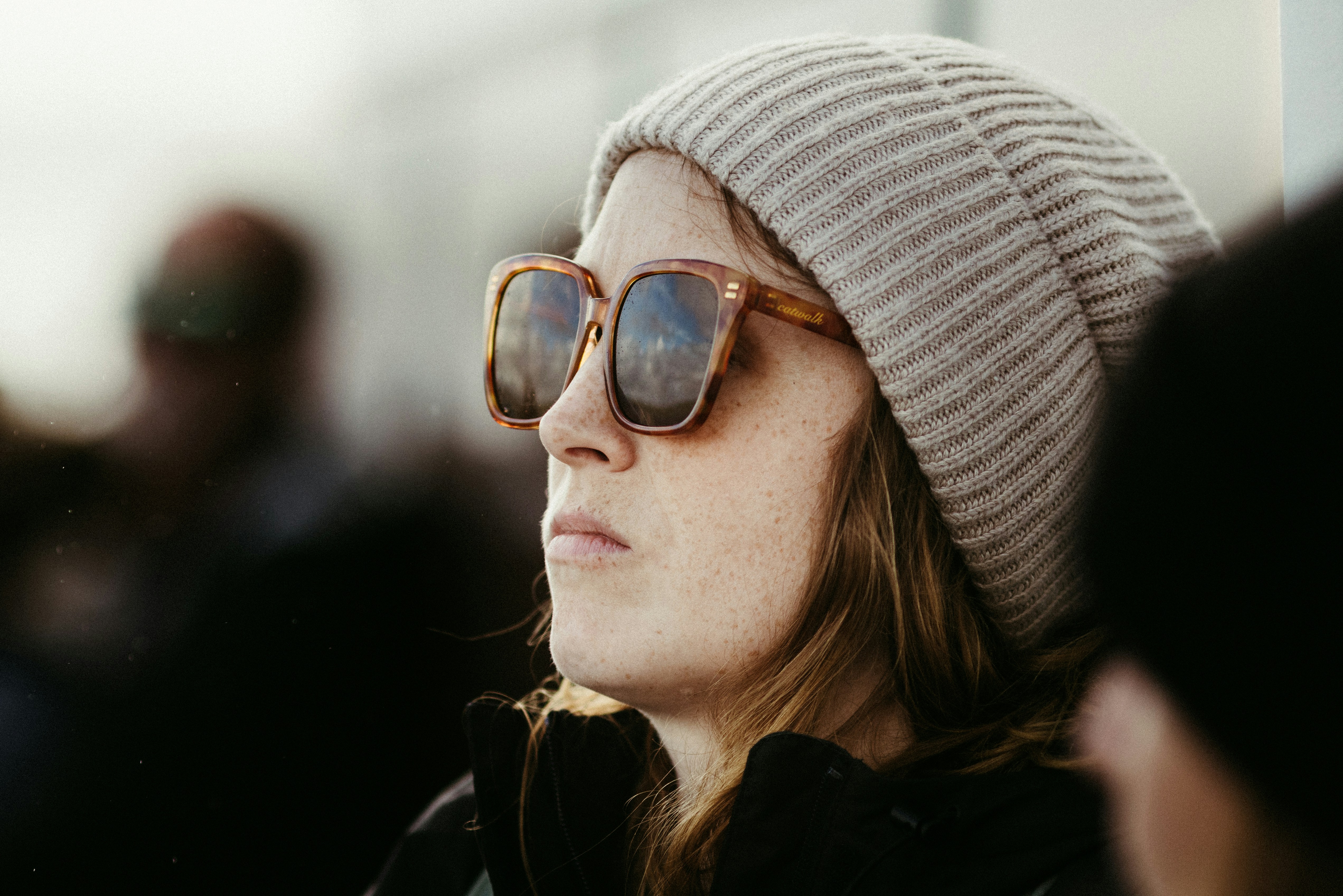 Quiet Gaze Through Soft Focus: Beanie and Oversized Frames Portrait
