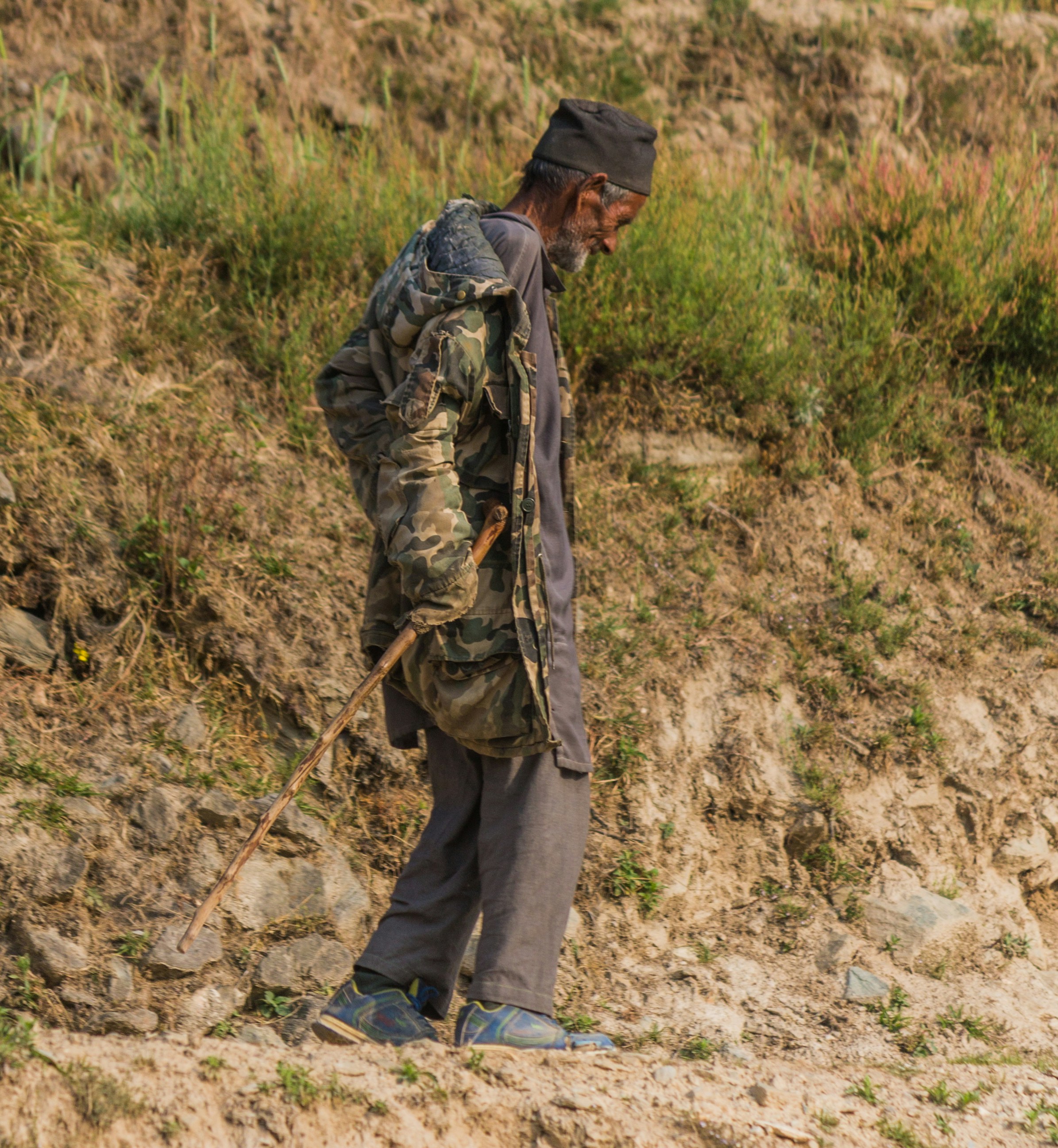 Old Man Walking with Stick in Darchula Village, Far Western Nepal