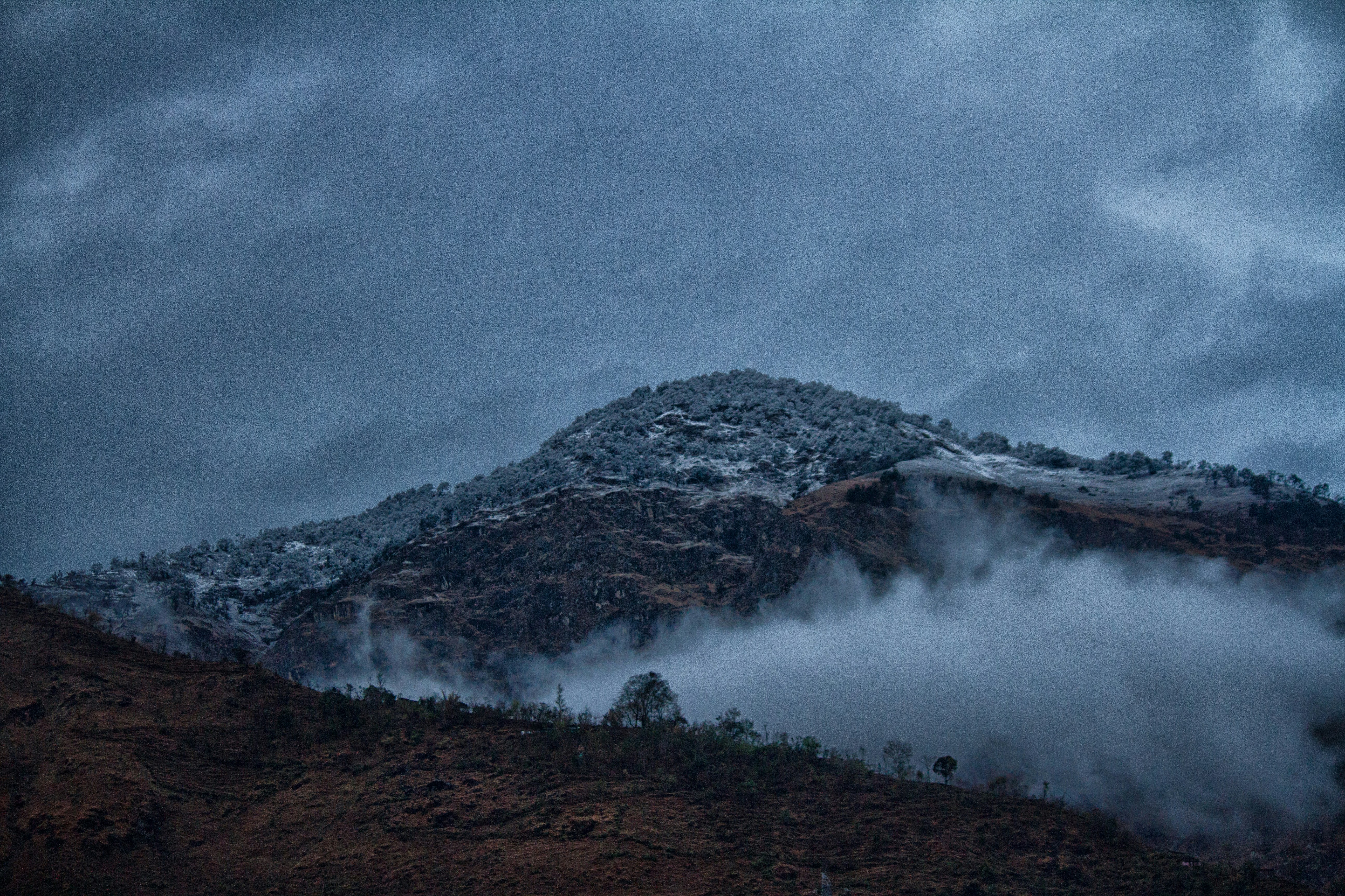 Snow-Covered Hill Seen Through Fog in Darchula Village, Far Western Nepal