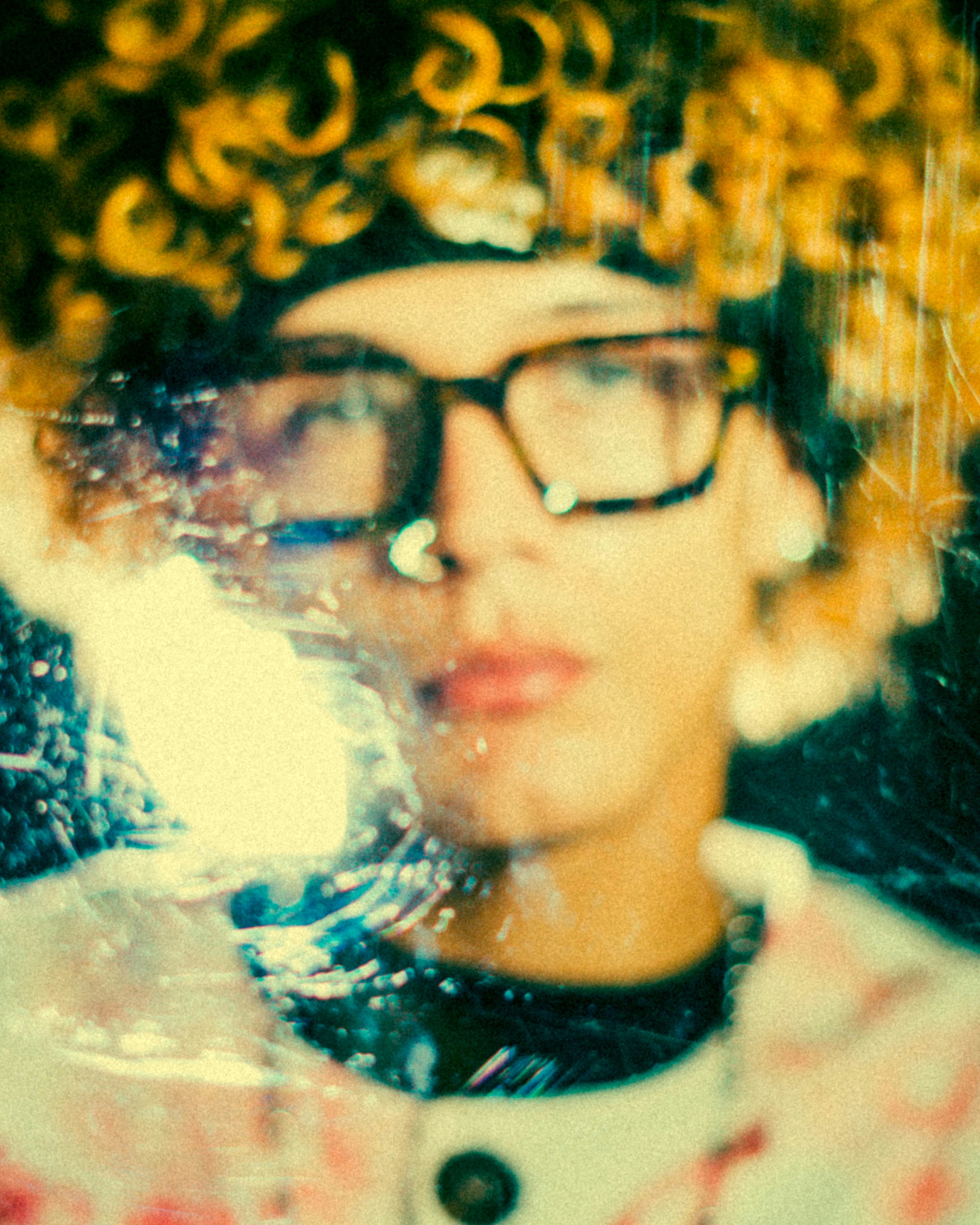 Blurred Glass, Neon Curls: A Self-Portrait Behind Scratches