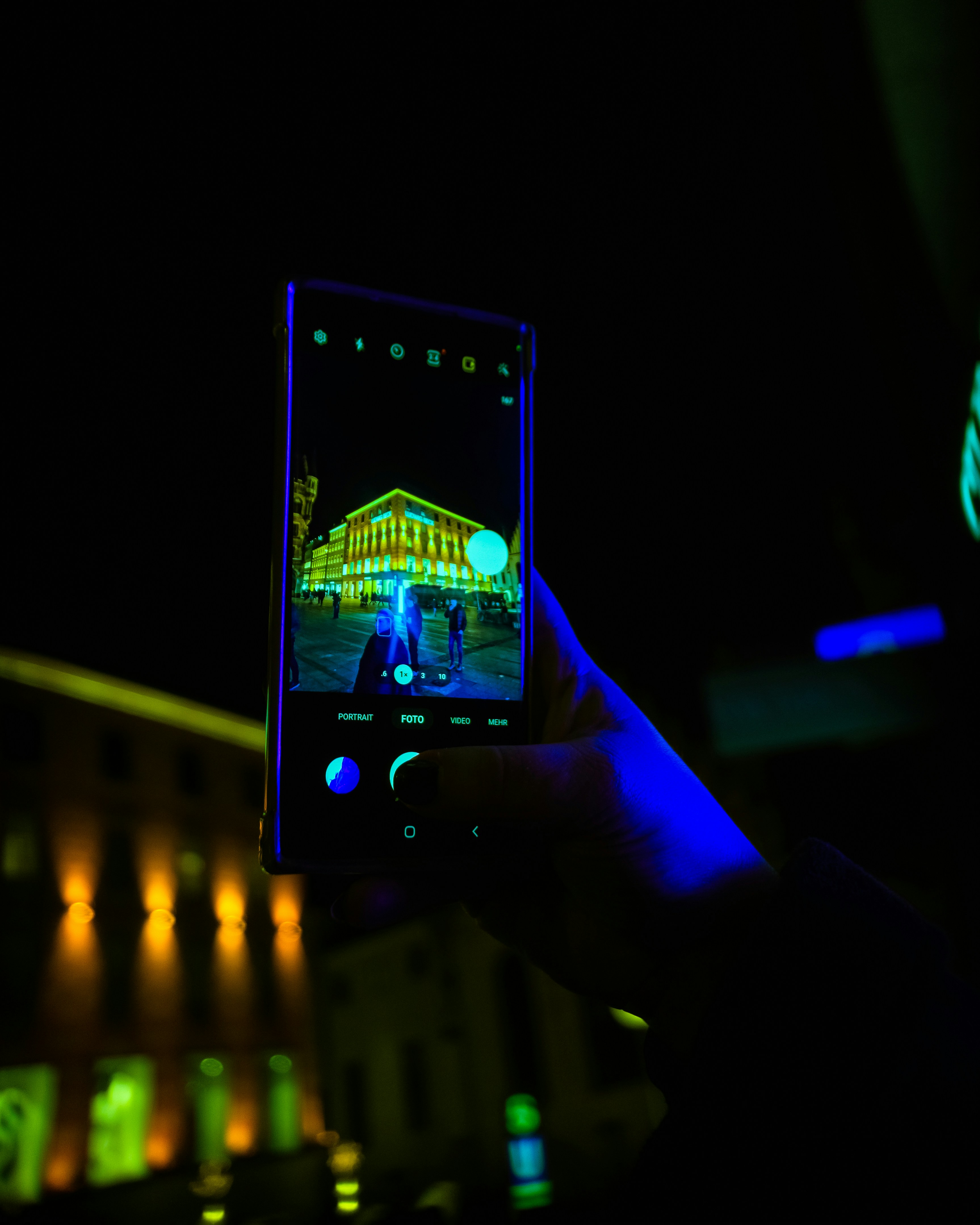 Neon Echoes: A Night Scene Framed by a Glowing Smartphone Screen