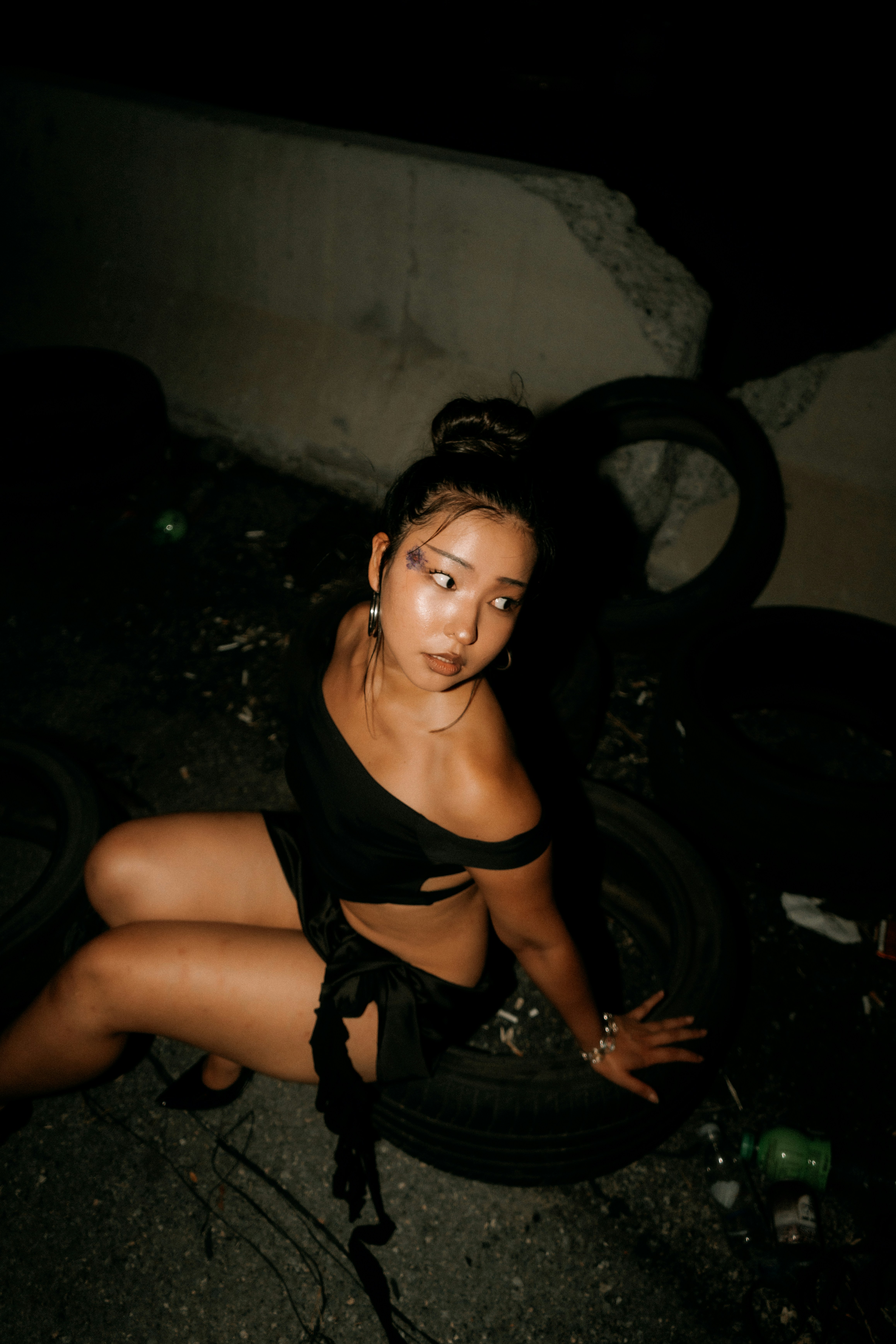 Noir in the Scrapyard: A Portrait Bathed in Torchlight
