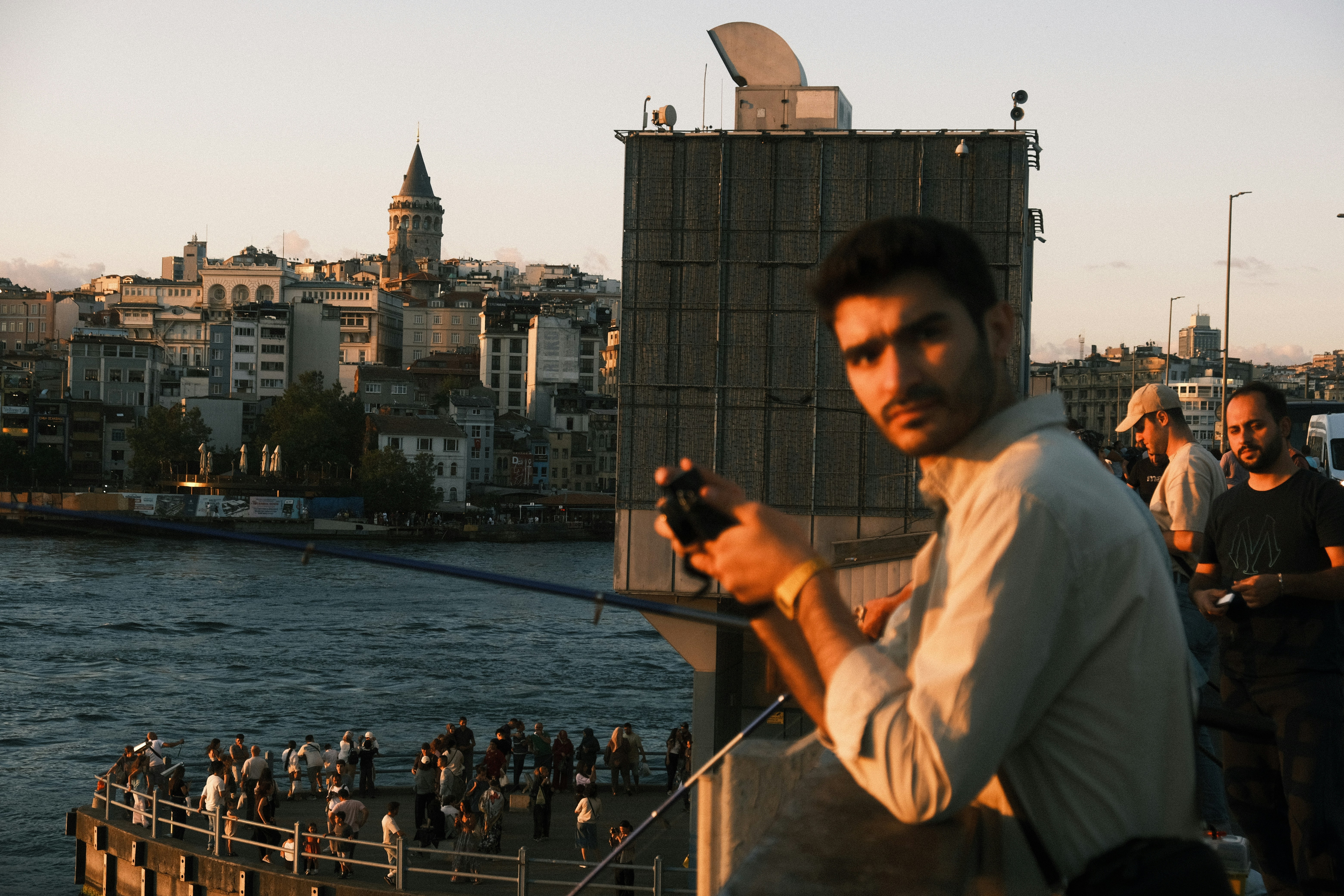 Golden Hour on the Galata Bridge: A Candid Portrait by the Bosphorus