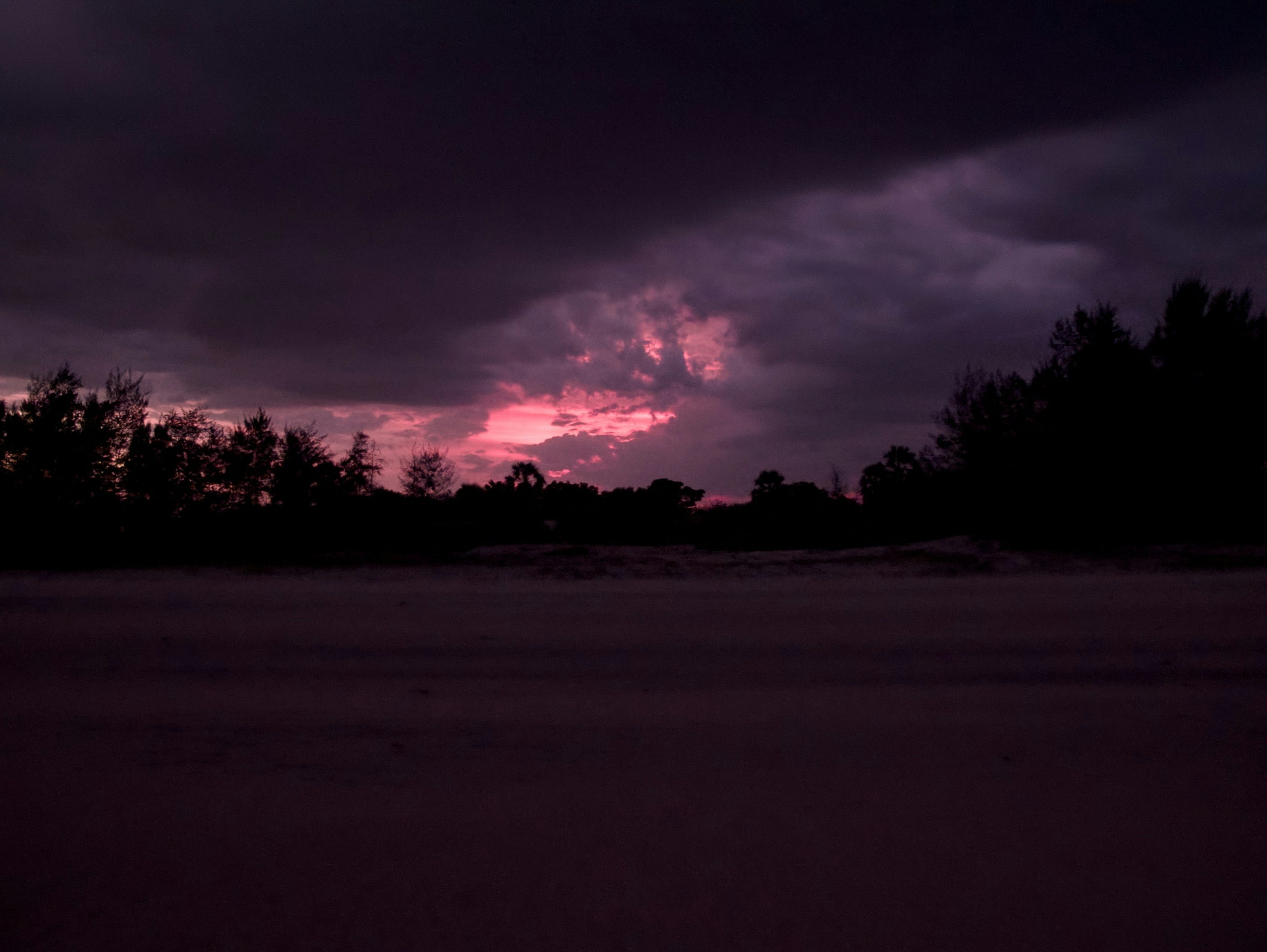 Crimson Break: Sunset Slip Over Quiet Dunes