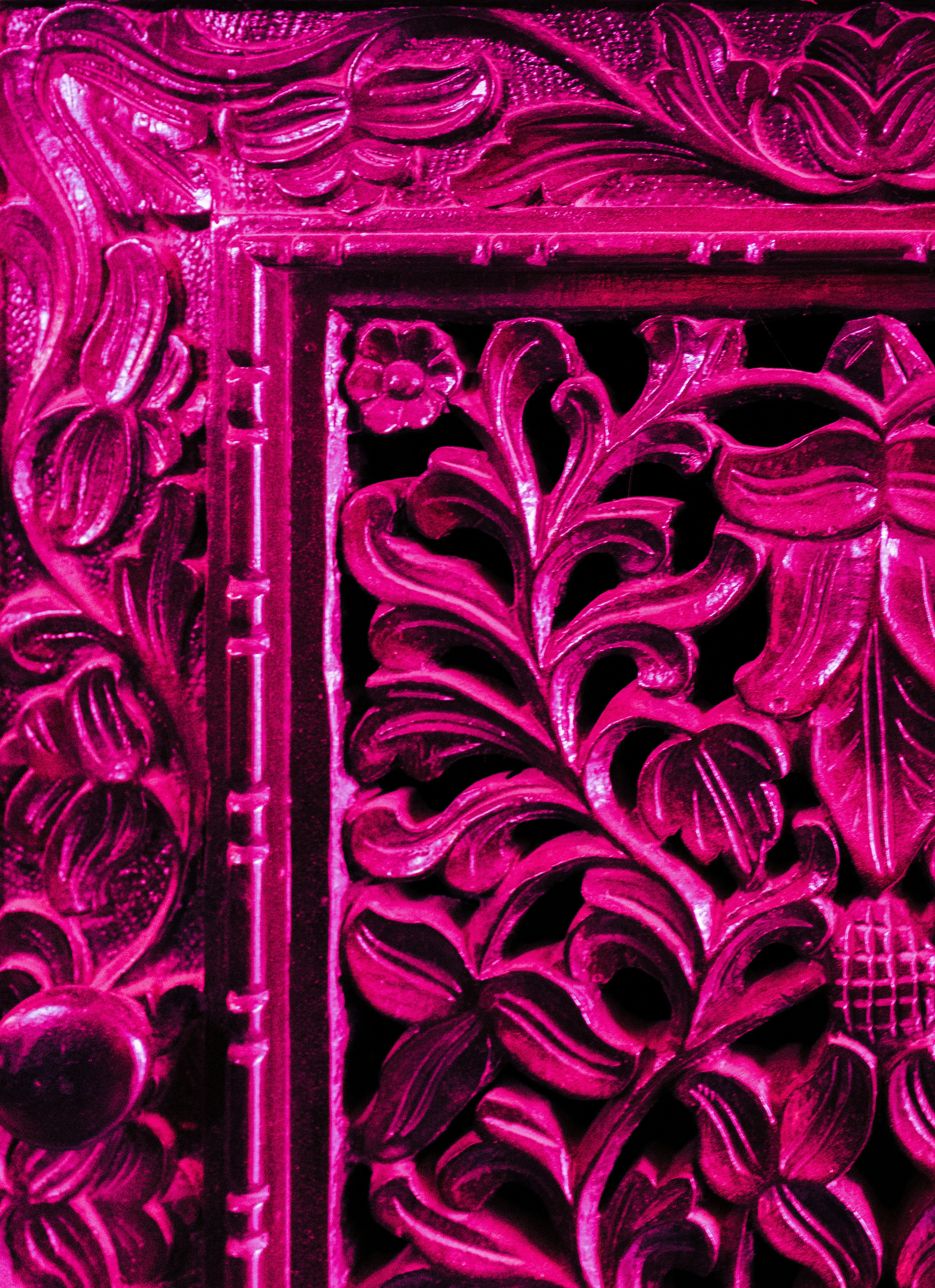 Crimson Relief: Velvet Magenta Floral Carvings in a Framed Panel