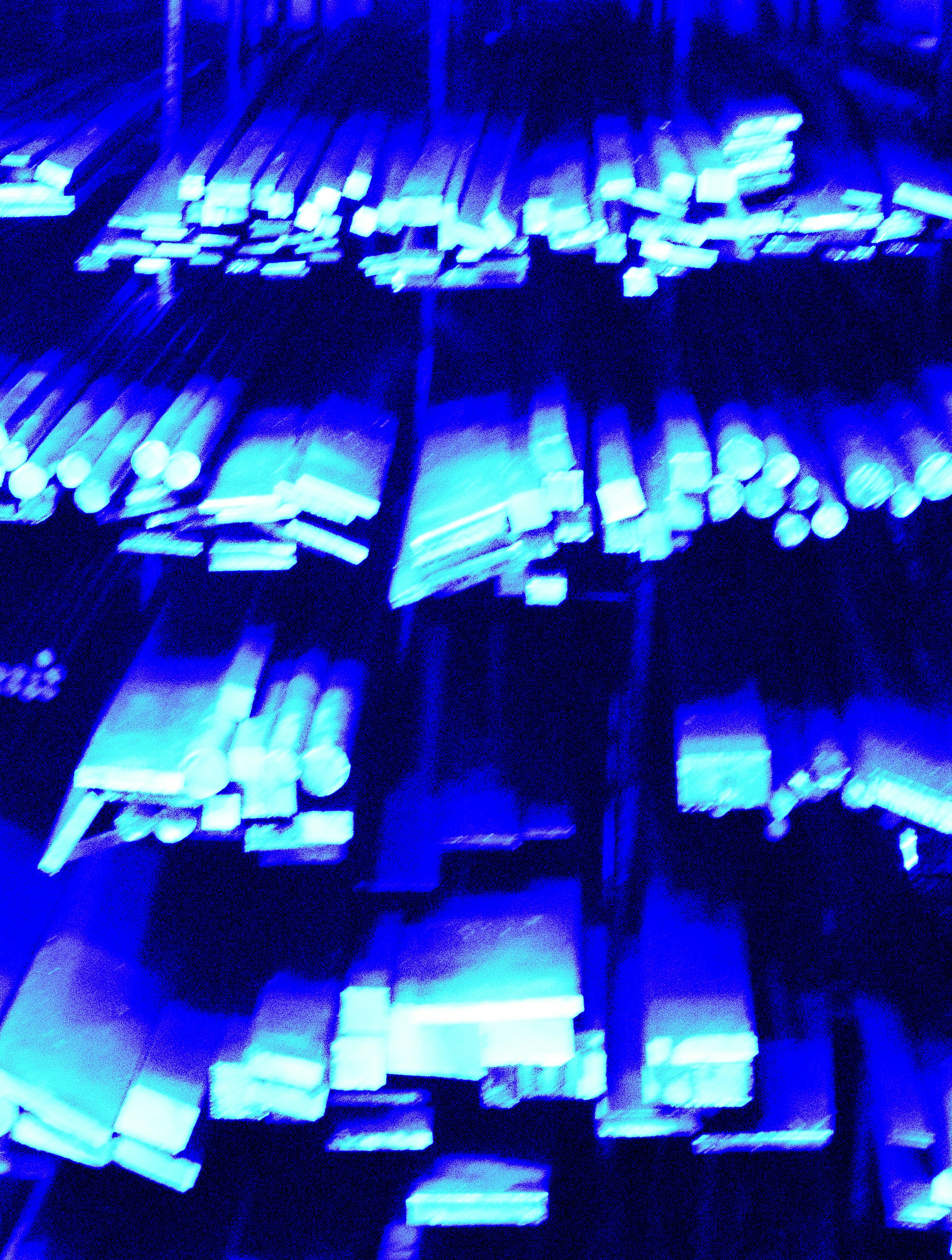 Rows of blue metal bars stacked on shelves photo – Free Background ...