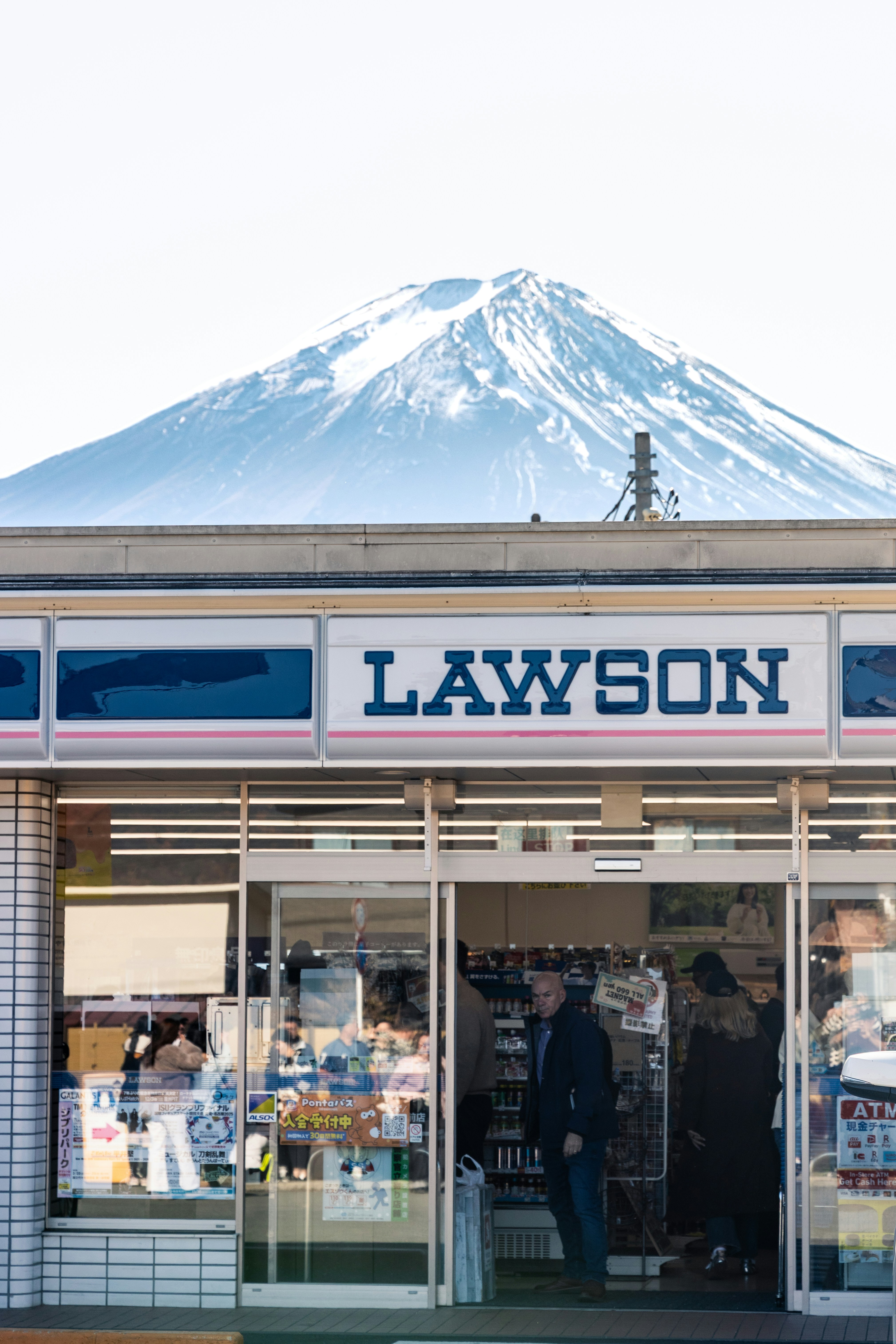 Fuji Framing Lawson: A Glass-Front Store Under Snow-Capped Peaks