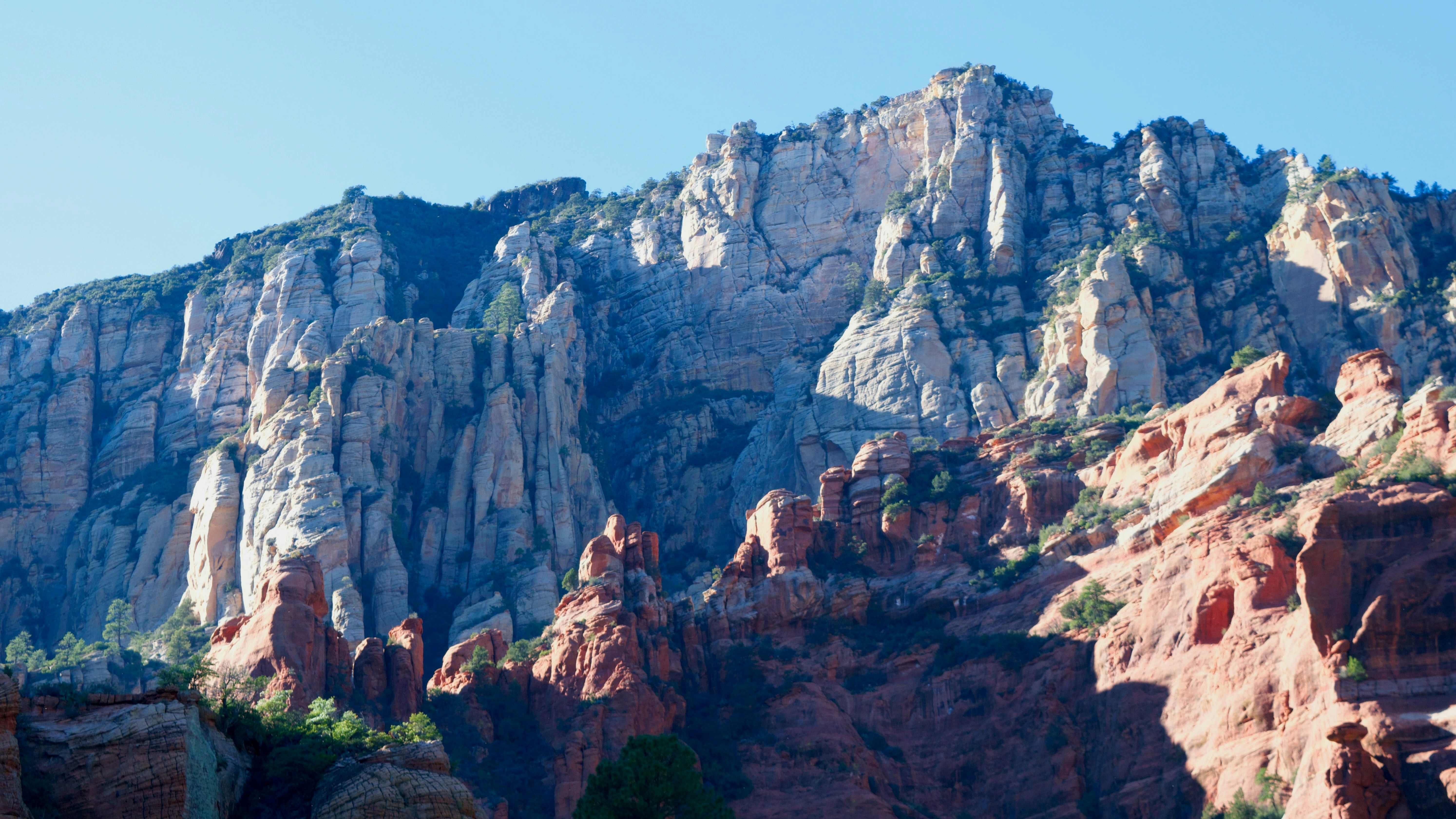 Crimson Cliffs Under a Cobalt Sky: Towering Redrock Formations in Quiet Light