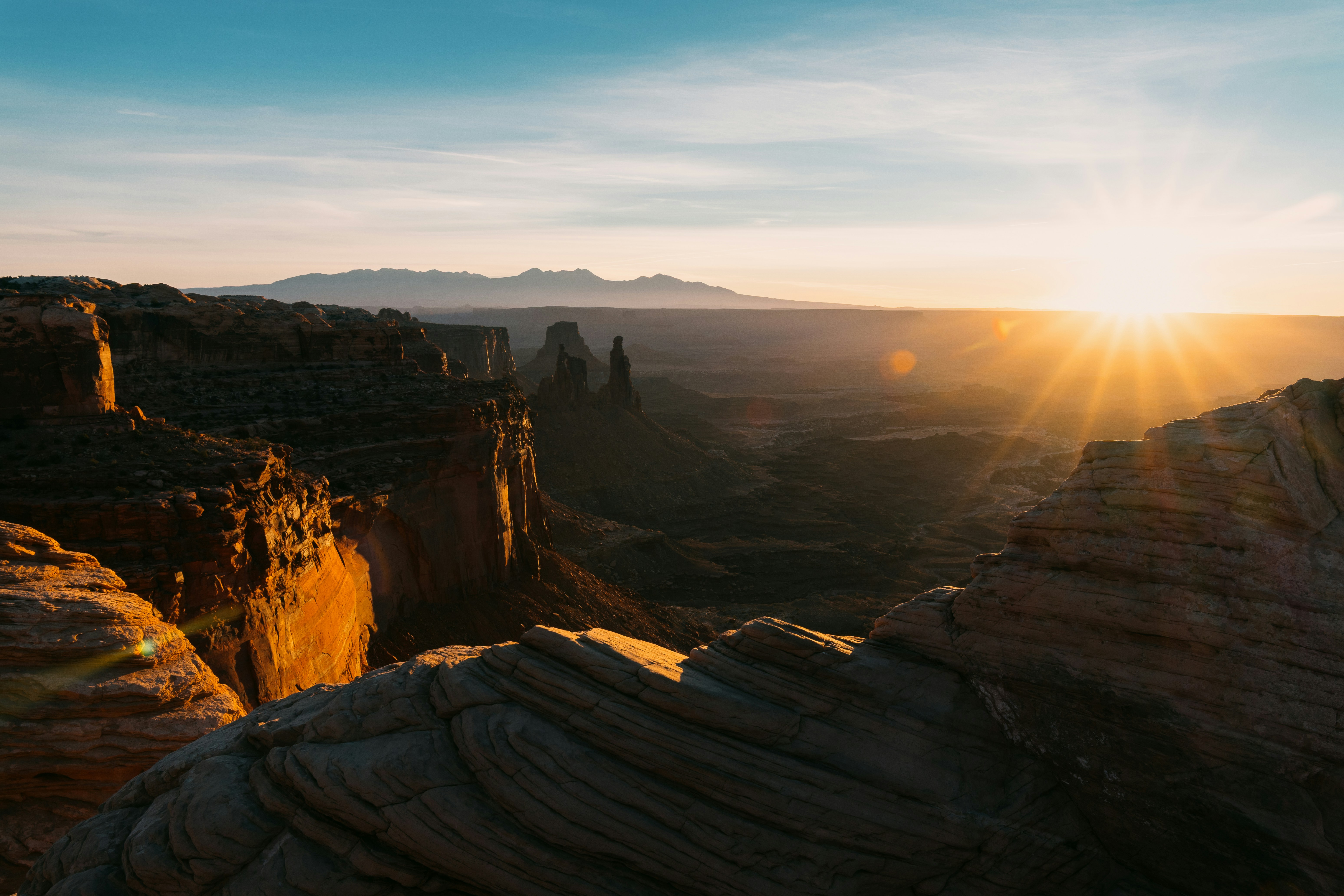 Sunburst Over Time-Worn Canyon at Golden Hour